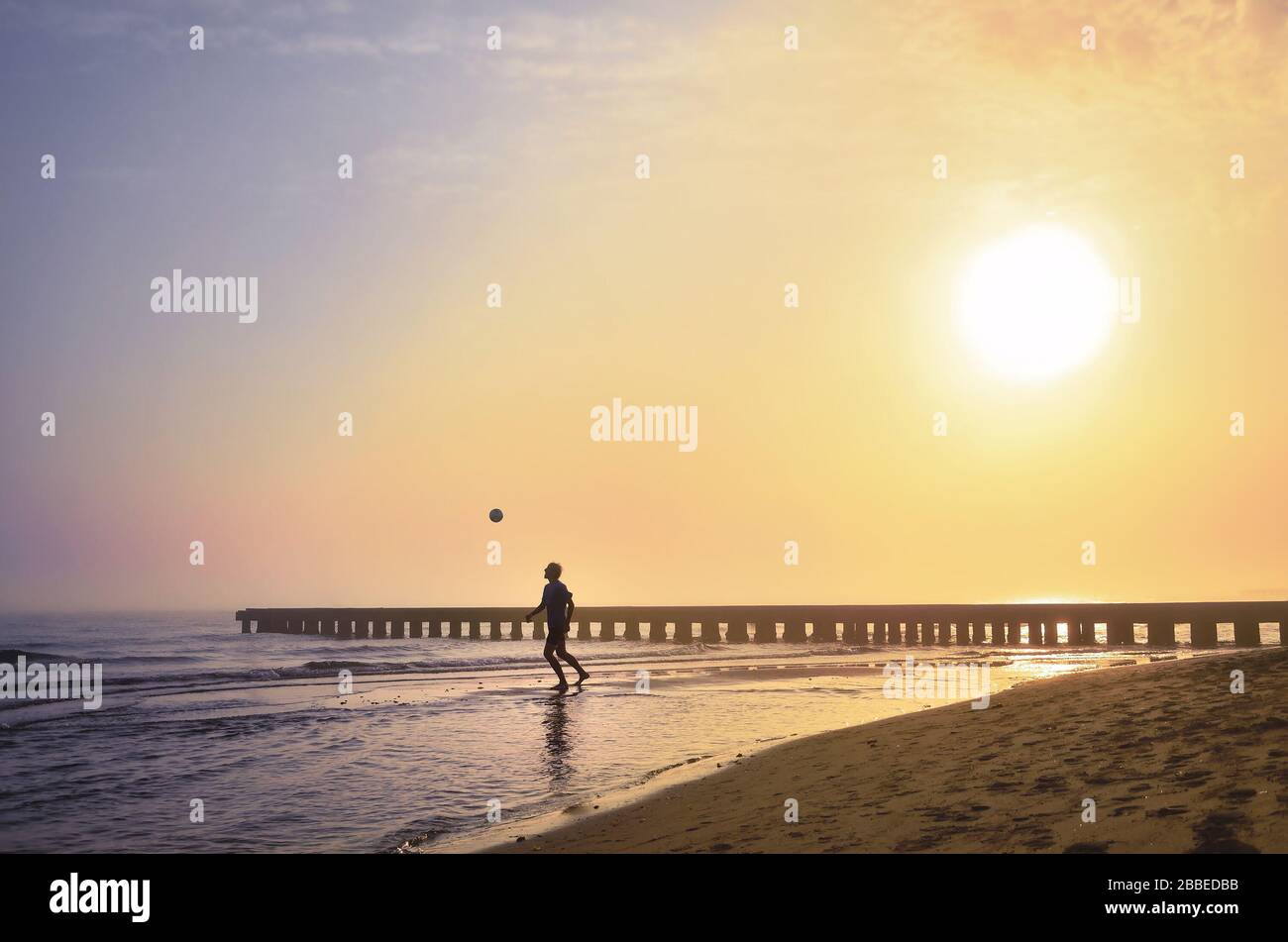 Football player at beach hi-res stock photography and images - Alamy