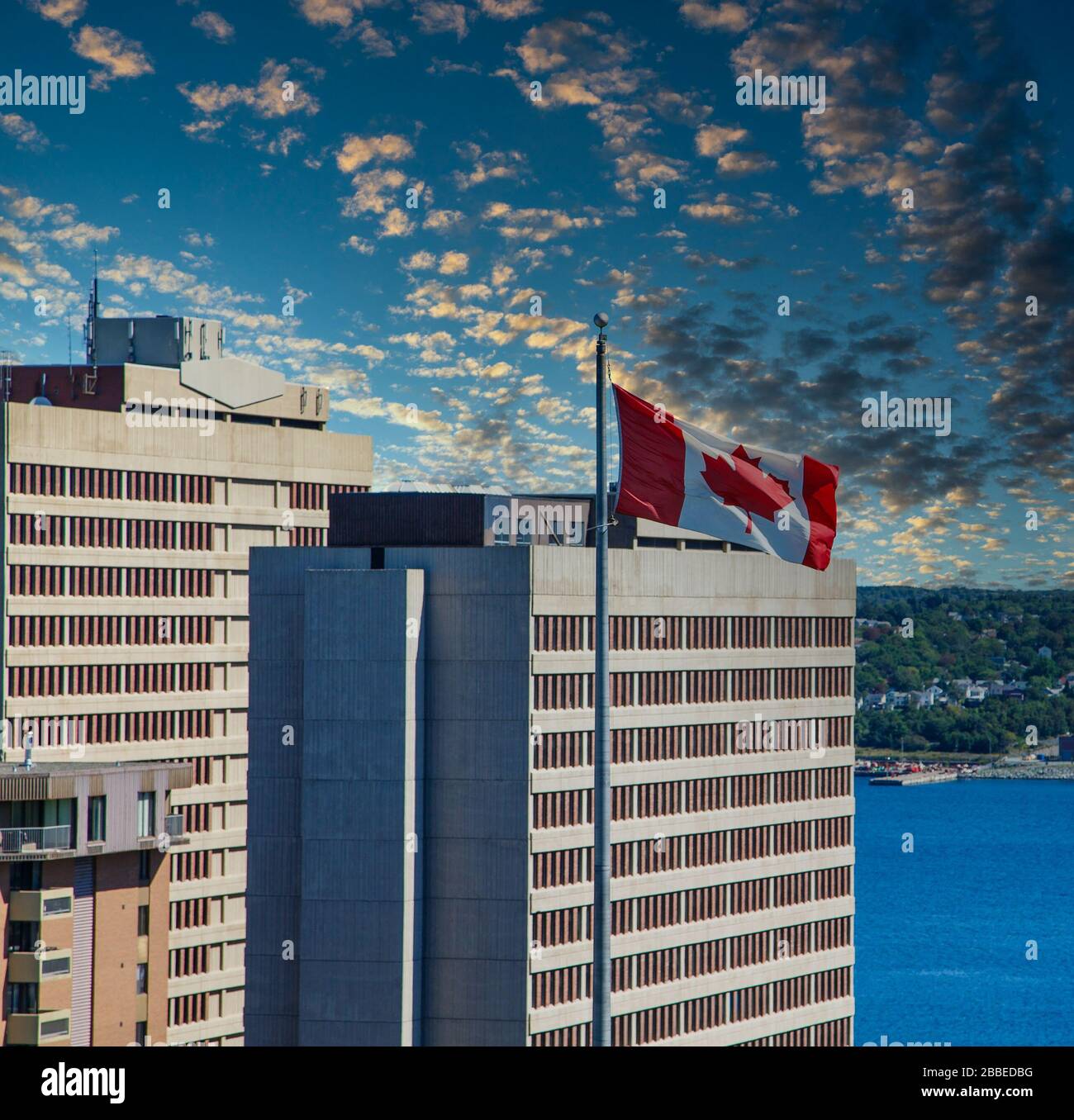 Canadian Flag by Office Buildings Stock Photo - Alamy