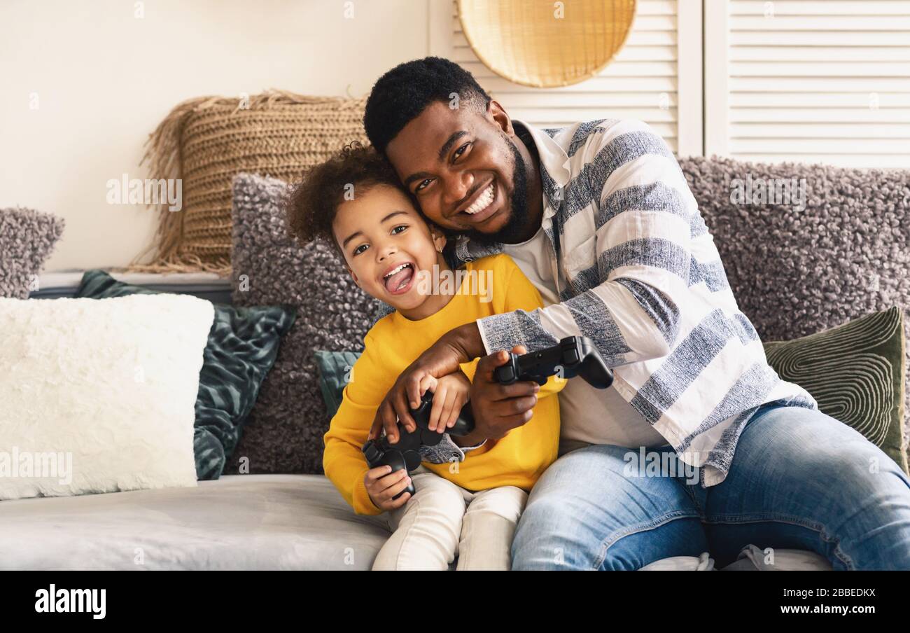 Dad and daughter have fun playing battle game Stock Photo - Alamy