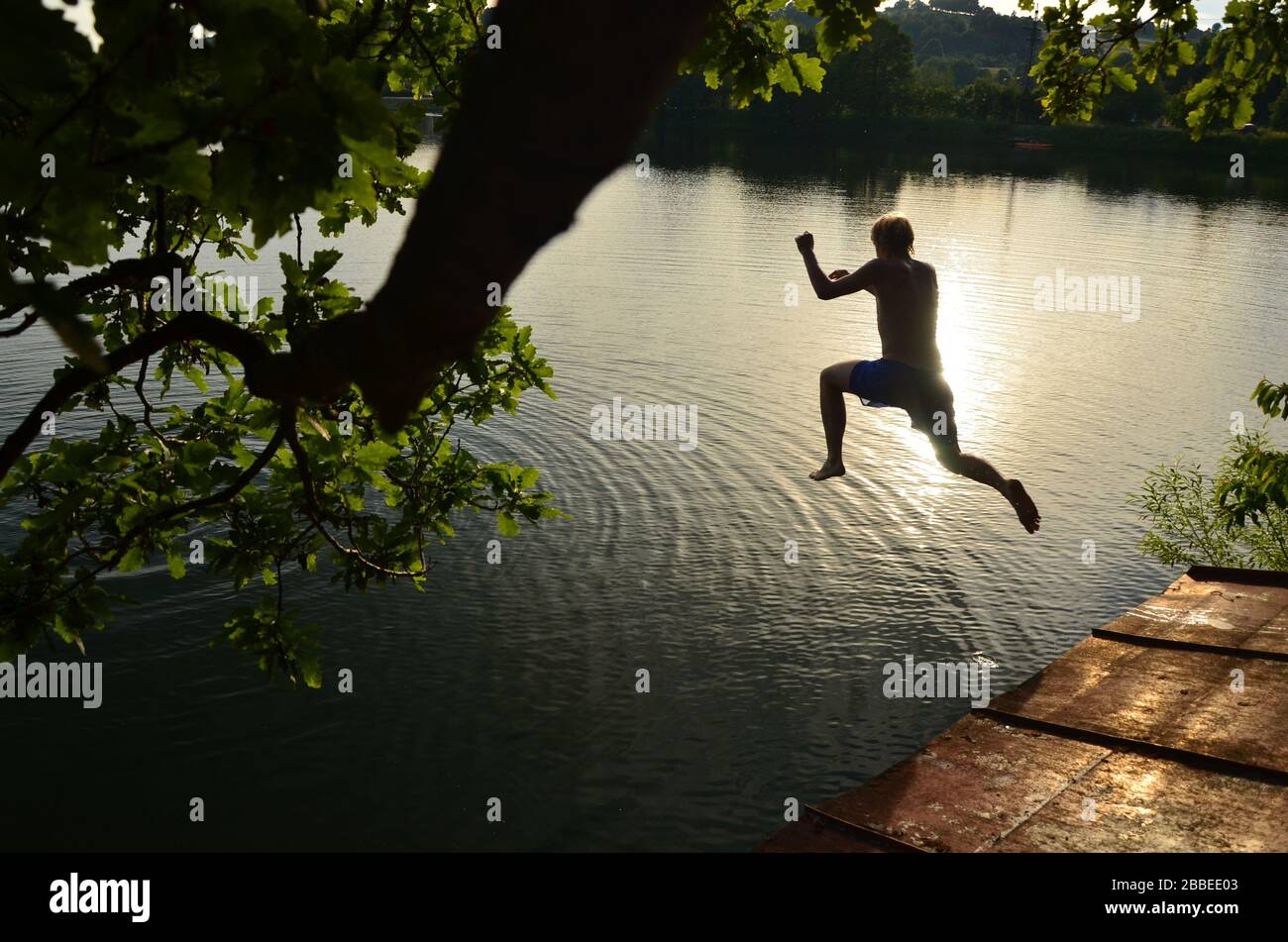 Team jumping in water hi-res stock photography and images - Alamy