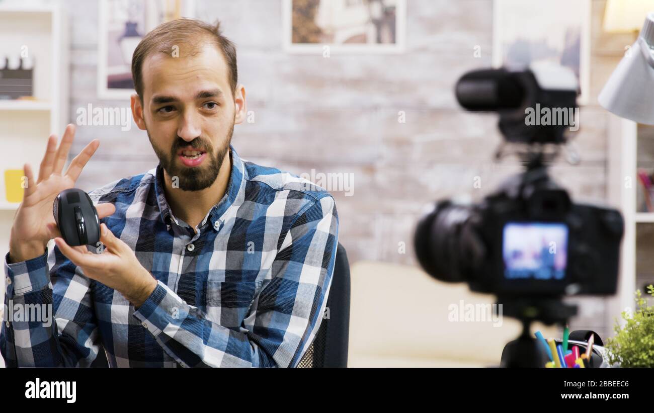 Famous vlogger filming mouse review for followers. Creative content ...