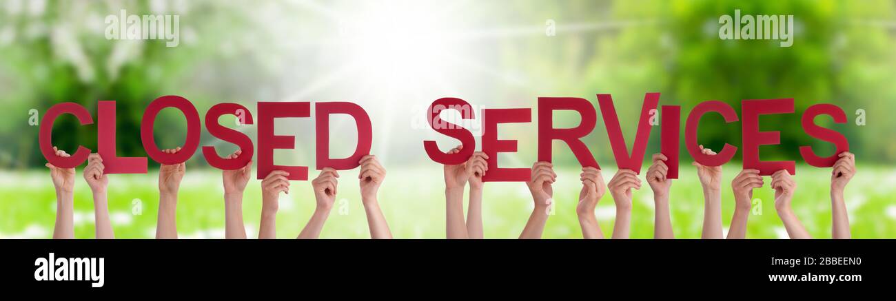 People Hands Holding Word Closed Services, Grass Meadow Stock Photo - Alamy