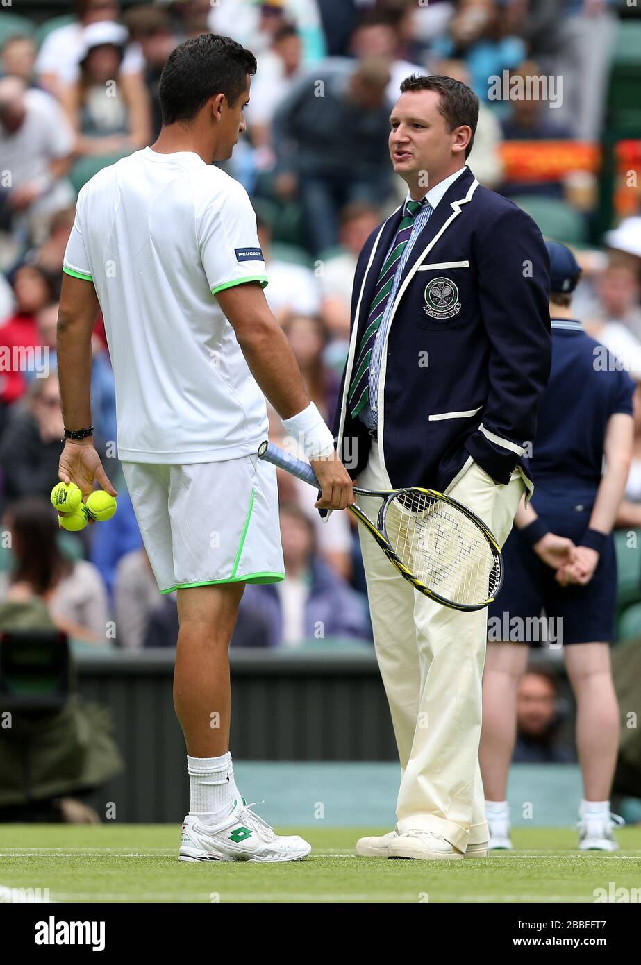Spain's Nicolas Almagro speaks with umpire Jake Garner as rain delays ...