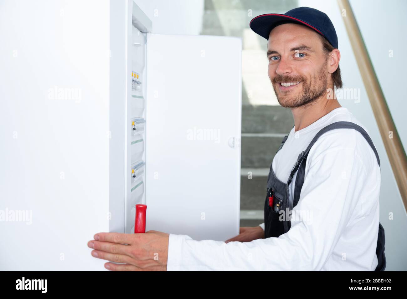 An electrician works on the house electrical system Stock Photo - Alamy