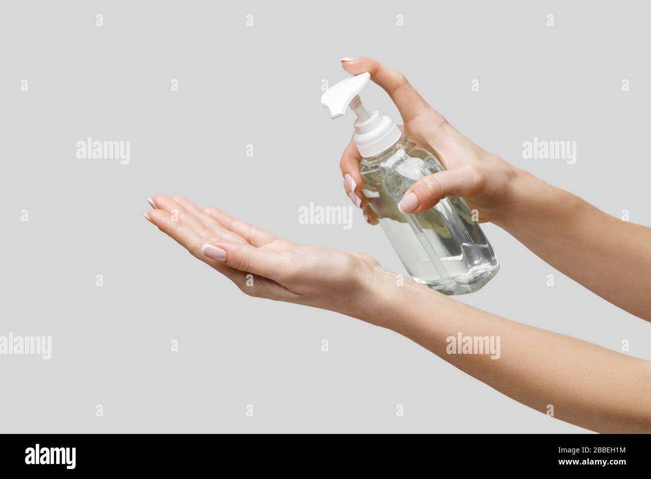 Female hands using hand sanitizer gel or liquid soap dispenser over ...