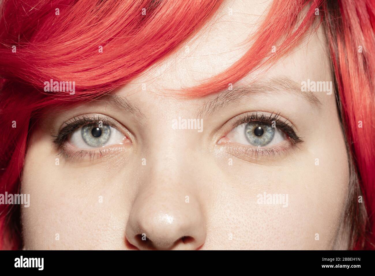Attented. Close up of face of beautiful caucasian young woman, focus on ...