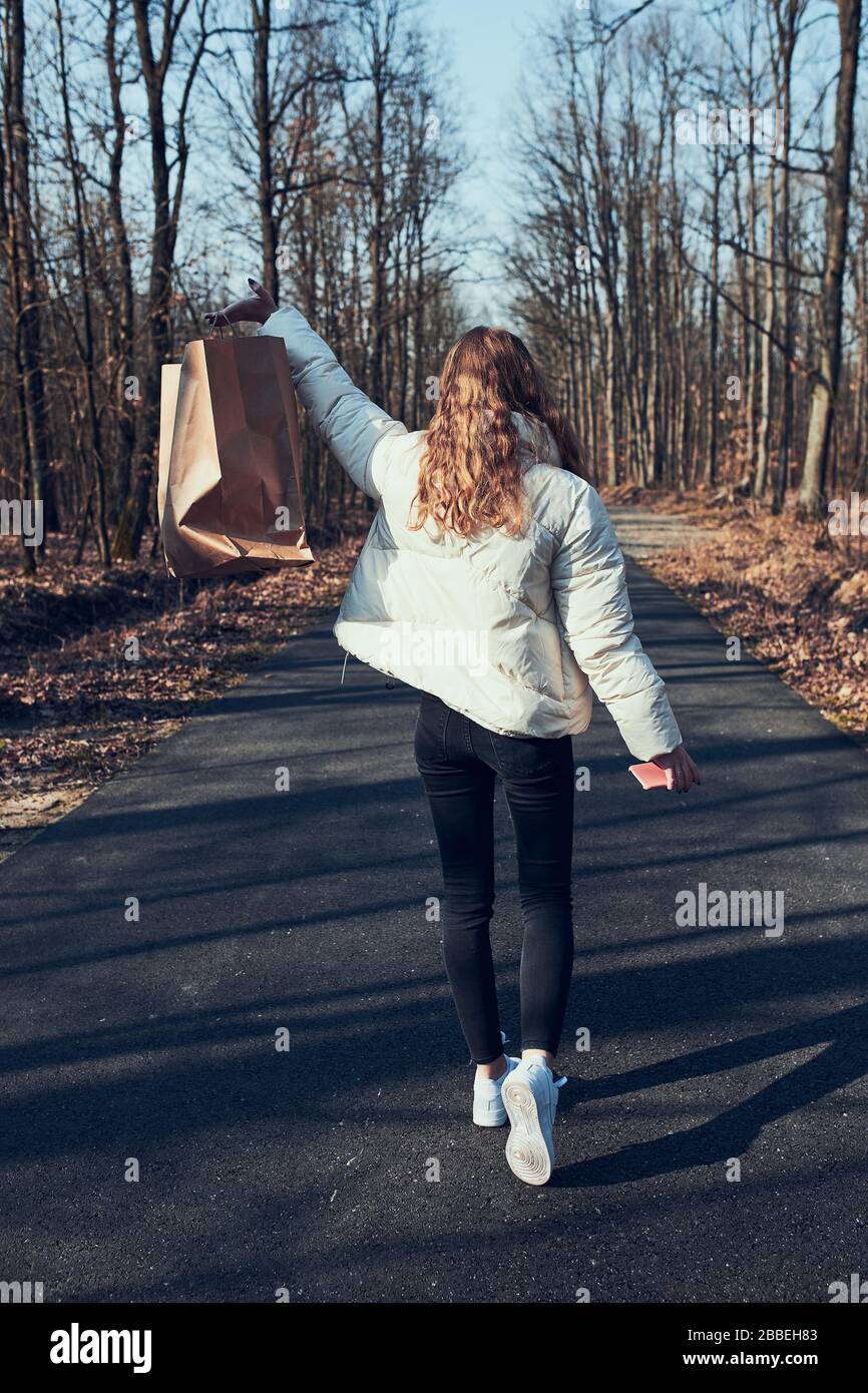 Girl walking with a bag hi-res stock photography and images - Alamy