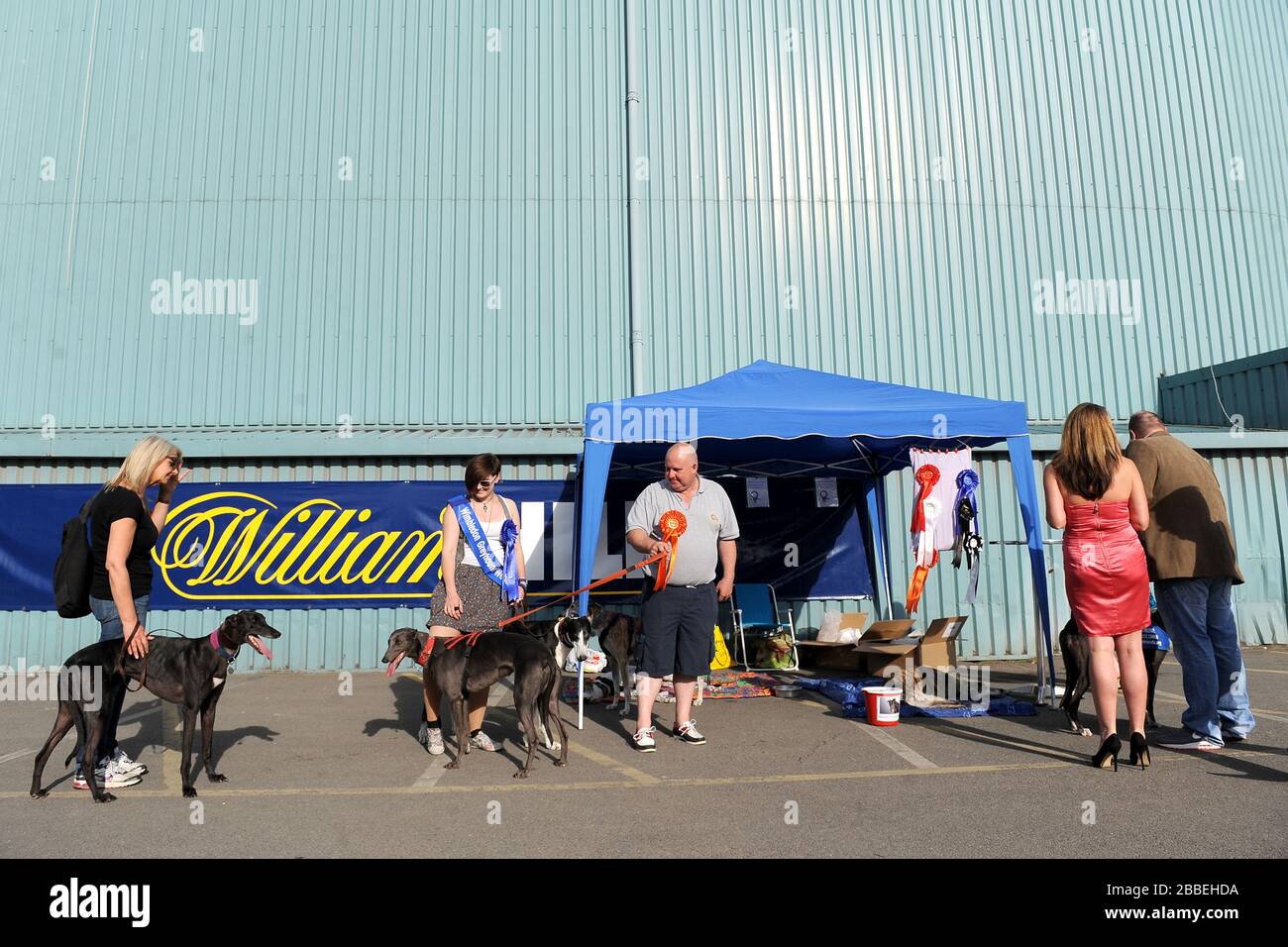 Spectators outside Wimbledon Stadium before the racing Stock Photo - Alamy
