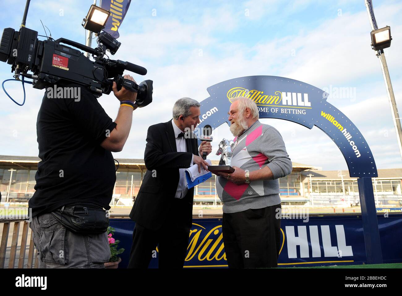 Winning connections of Ballymac Jones is interviewed after winning the ...