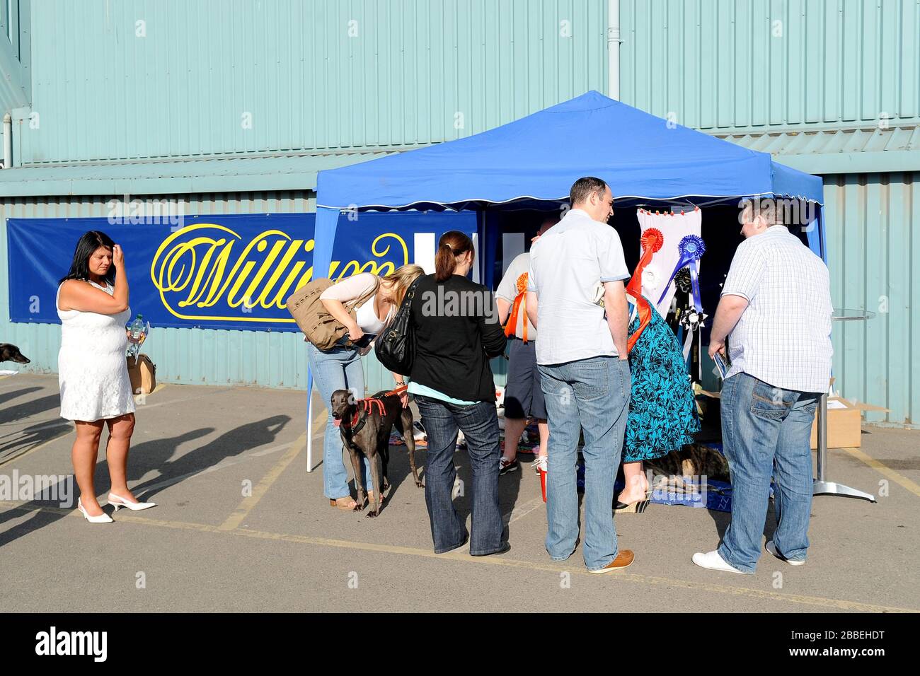 Spectators outside Wimbledon Stadium before the racing Stock Photo - Alamy