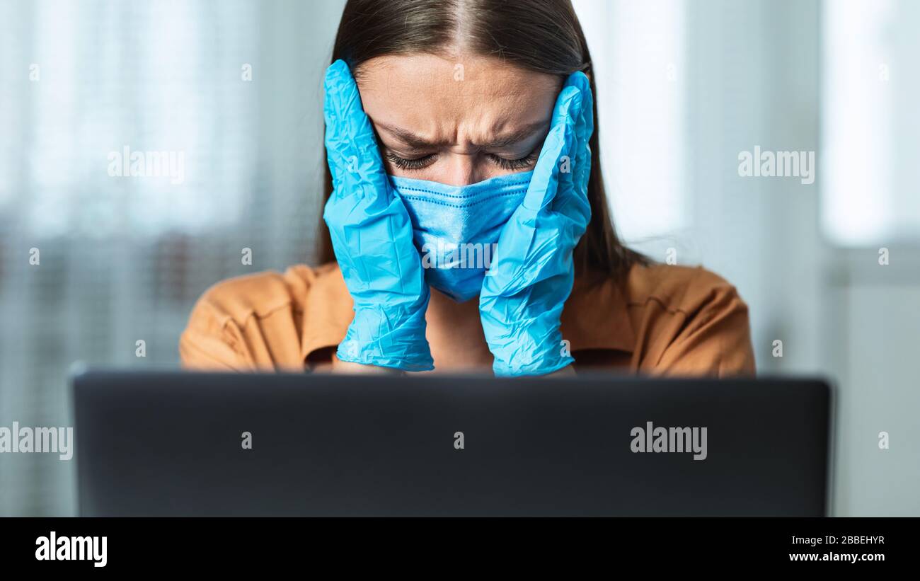 Girl in quarantine wearing mask and crying Stock Photo - Alamy
