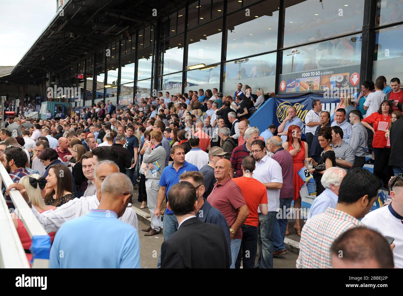 Spectators watch the action in the stands Stock Photo - Alamy