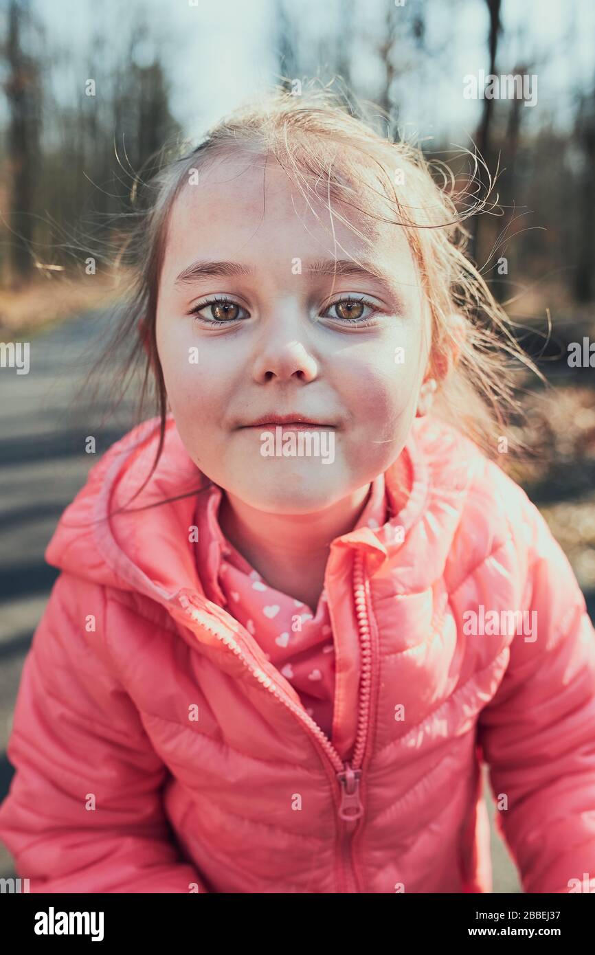 Portrait of little girl playing in the park, having fun on sunny autumn ...