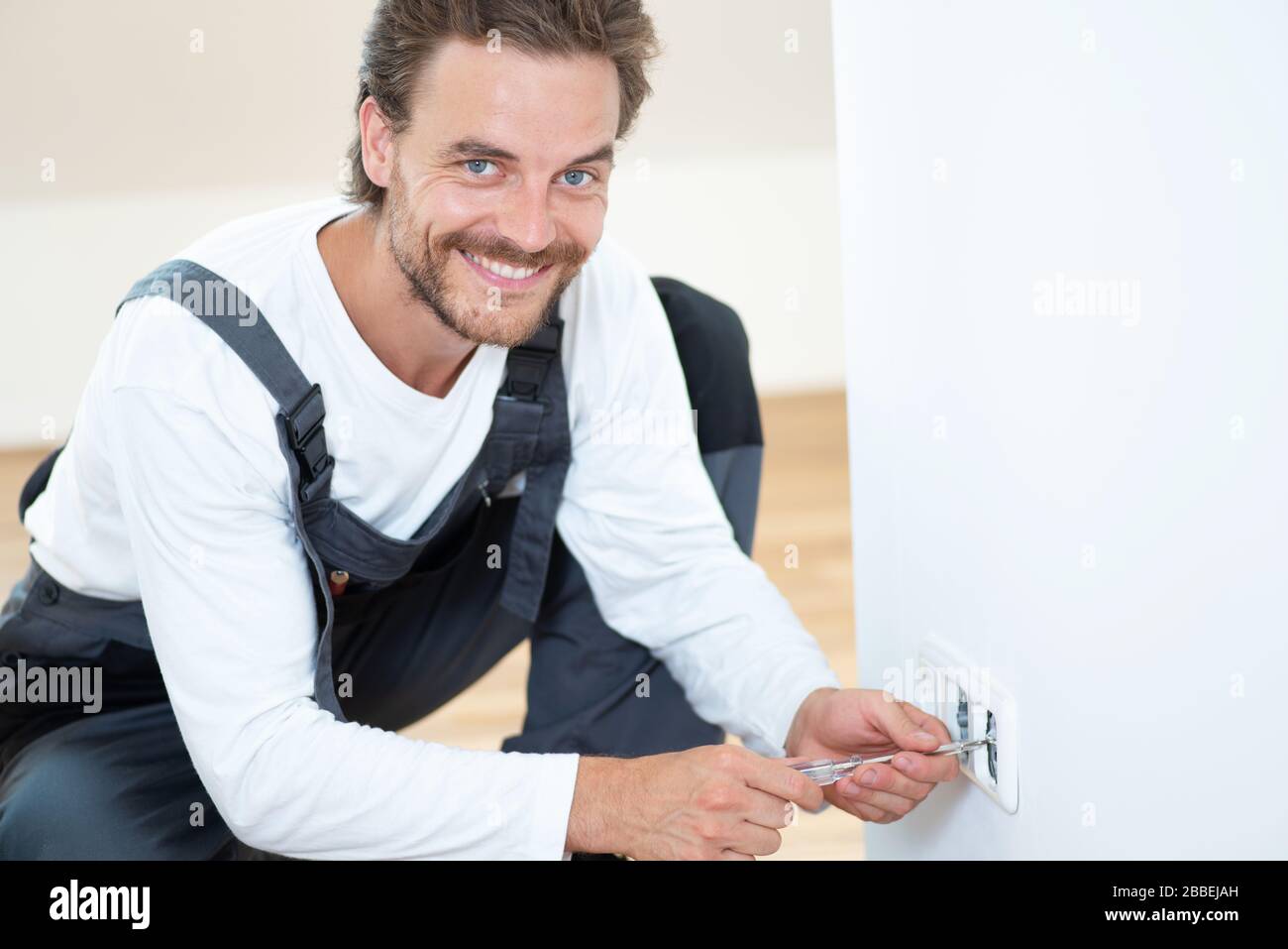An electrician works on the house electrical system Stock Photo - Alamy