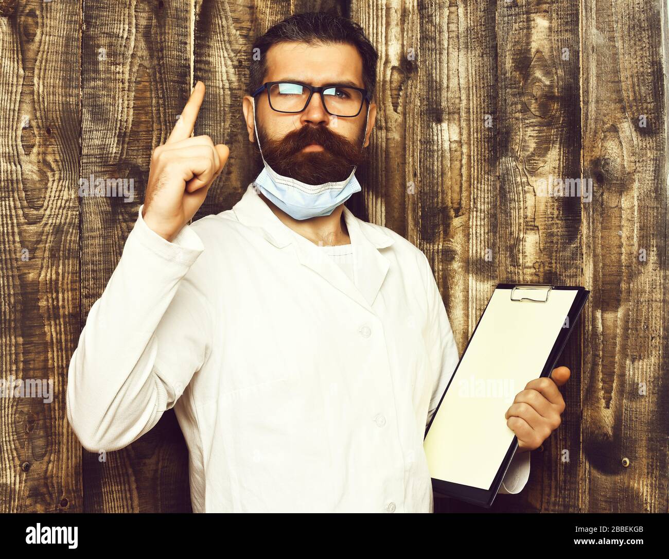 Bearded man, long beard. Brutal caucasian doctor or unshaven hipster ...