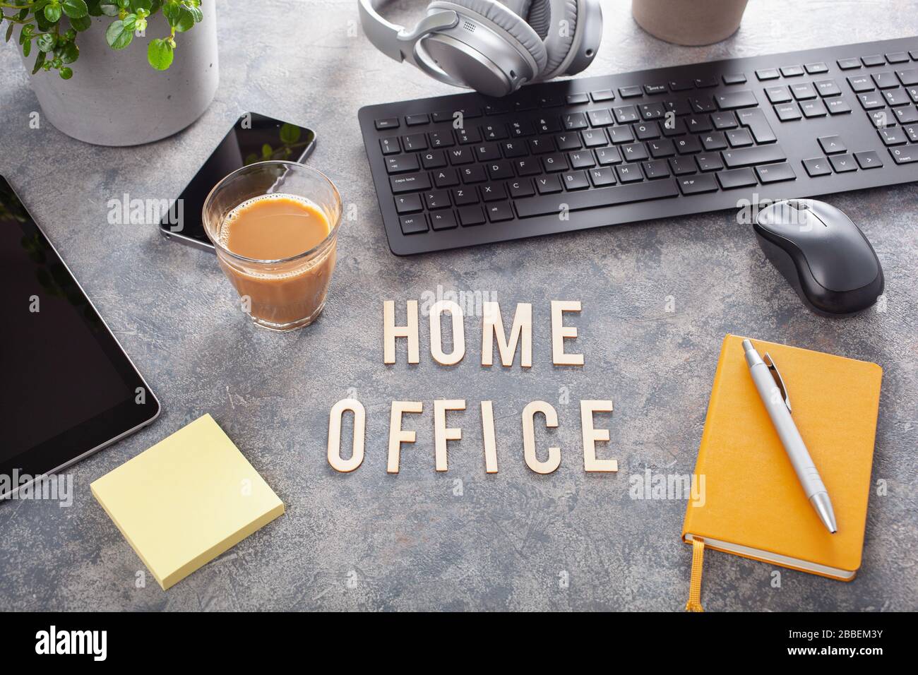home office text desk with keyboard computer smartphone notebook ...