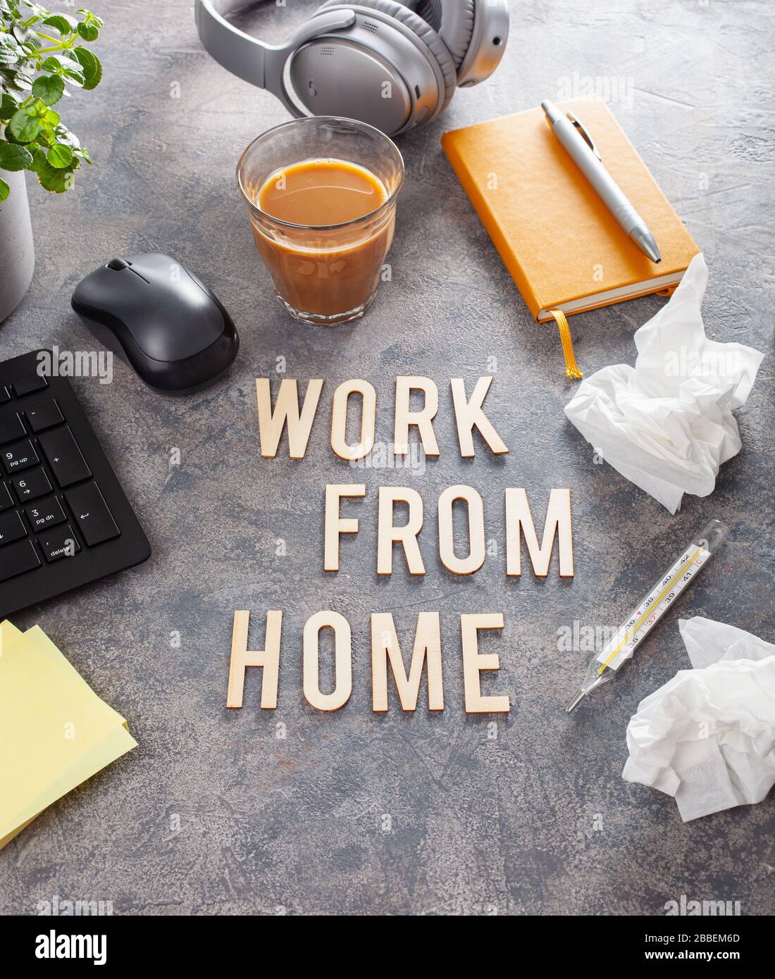 work from home text desk with keyboard computer notebook houseplants ...