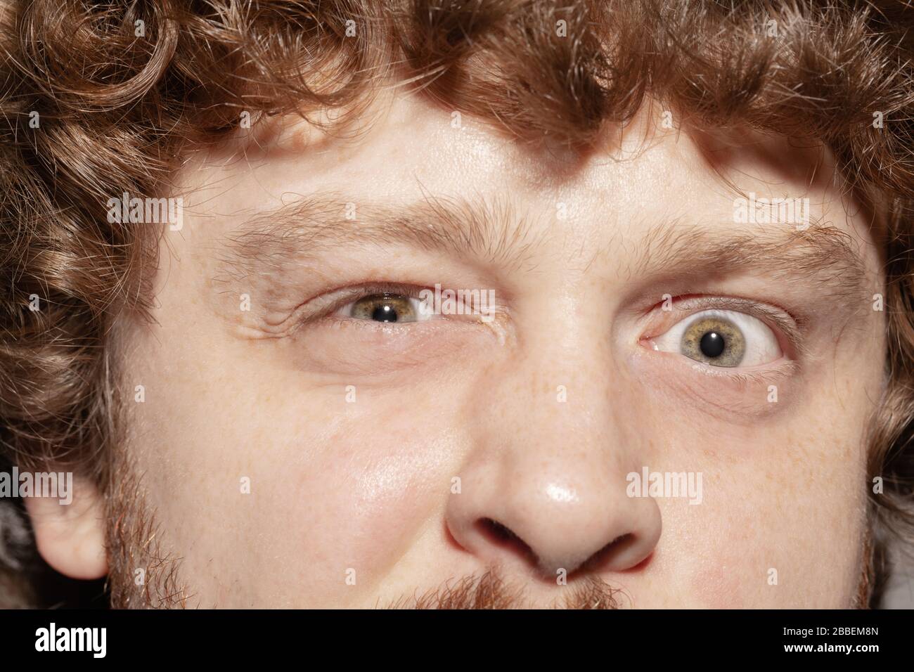 Looking scared. Close up of face of beautiful caucasian young man ...