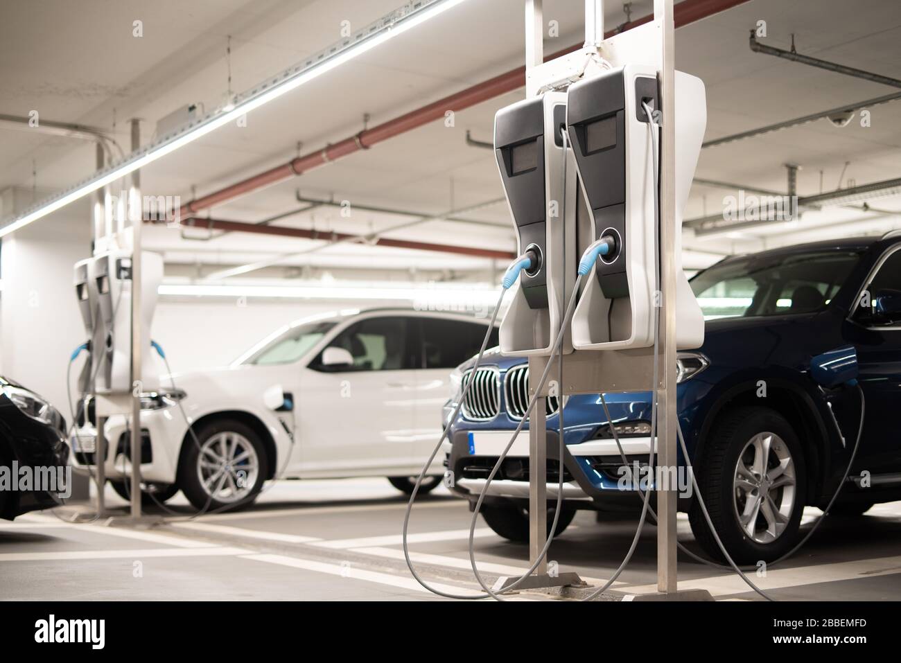 Electric cars at a charging station in an underground car park Stock ...