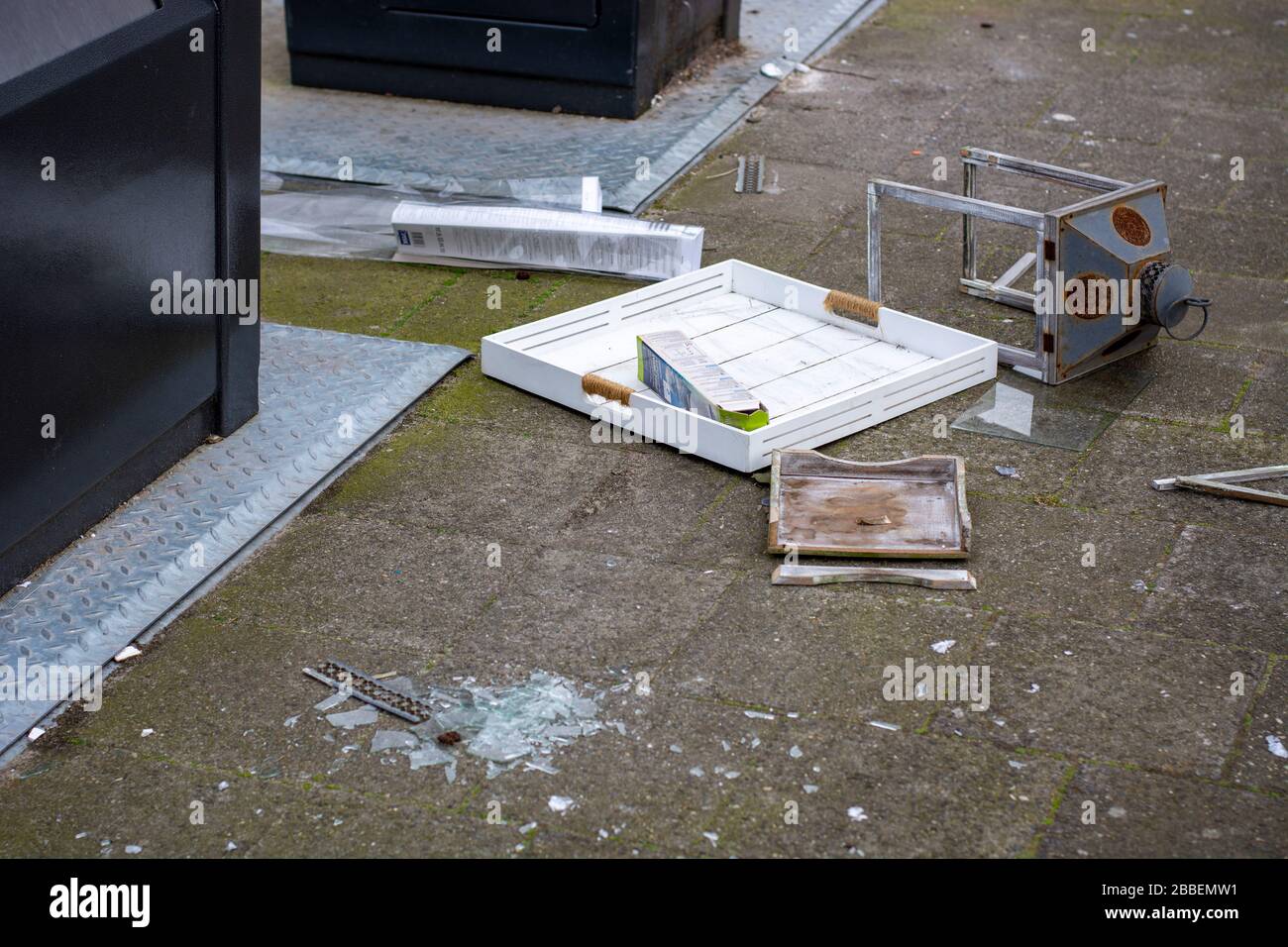 Underground containers with trash, including glass, next to it on the ...