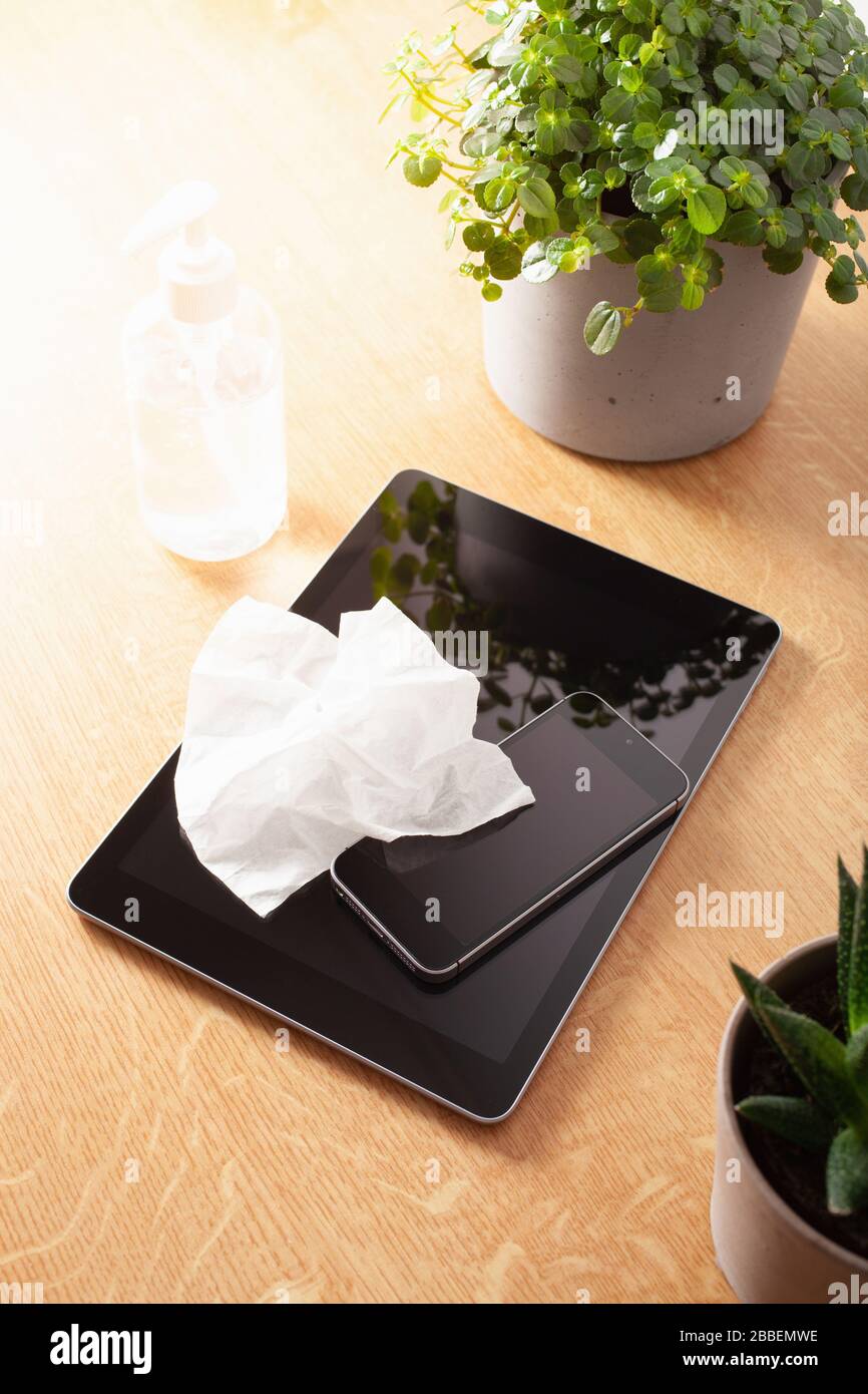 disinfecting tablet computer and smartphone screen, eliminating germs ...