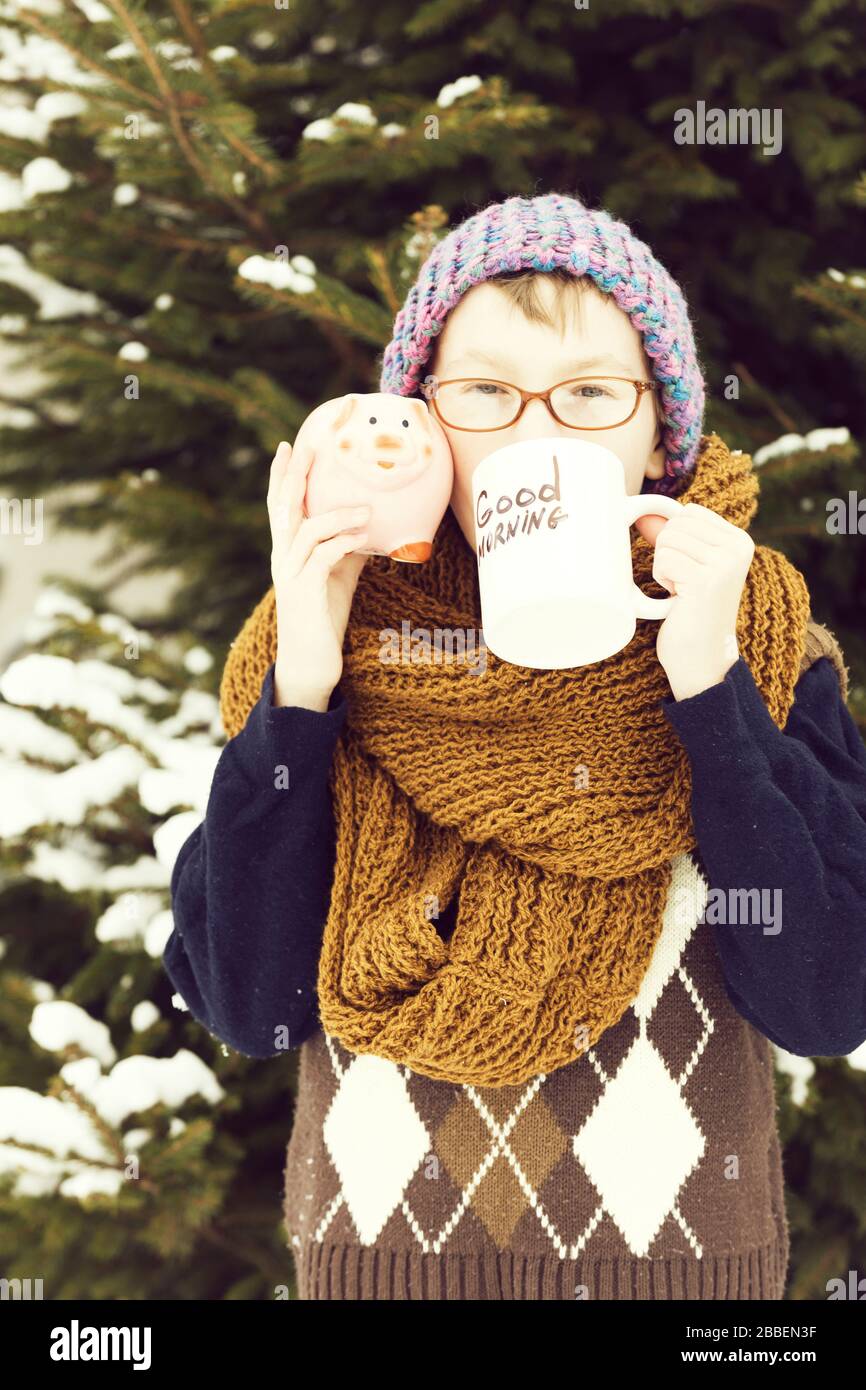 small boy or cute nerd kid in glasses, hat, sweater and fashionable ...