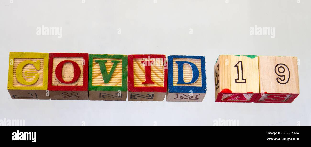 The term covid-19 displayed visually on a clear background using ...