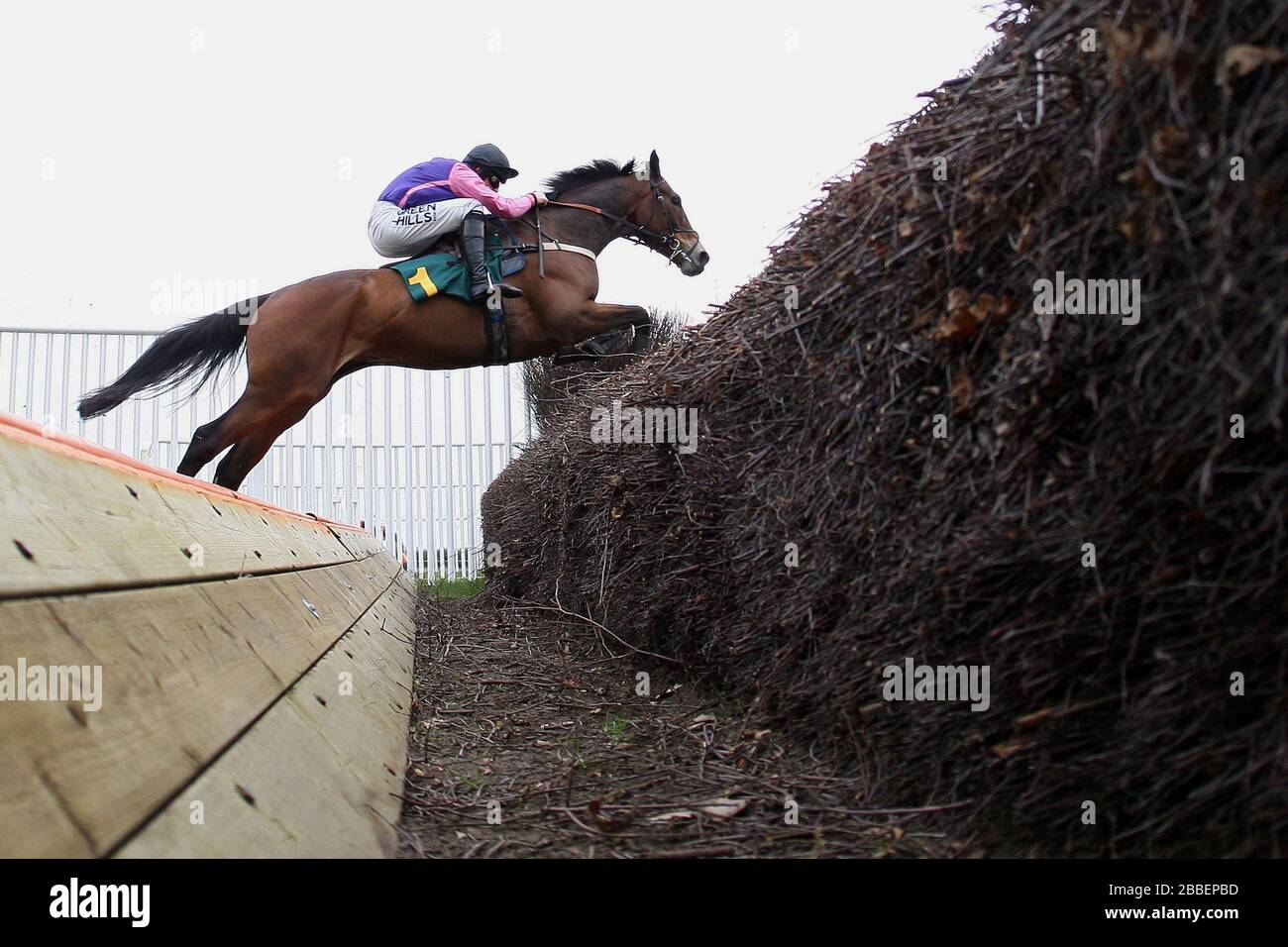 Lord Singer ridden by Joshua Moore jumps the open ditch during the Tim ...
