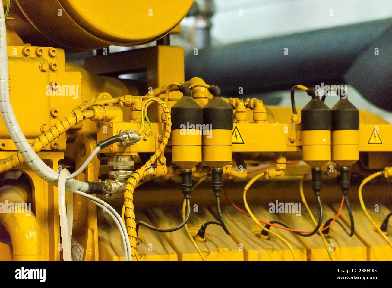 Fragment of yellow industrial diesel engine for electrical generator in ...
