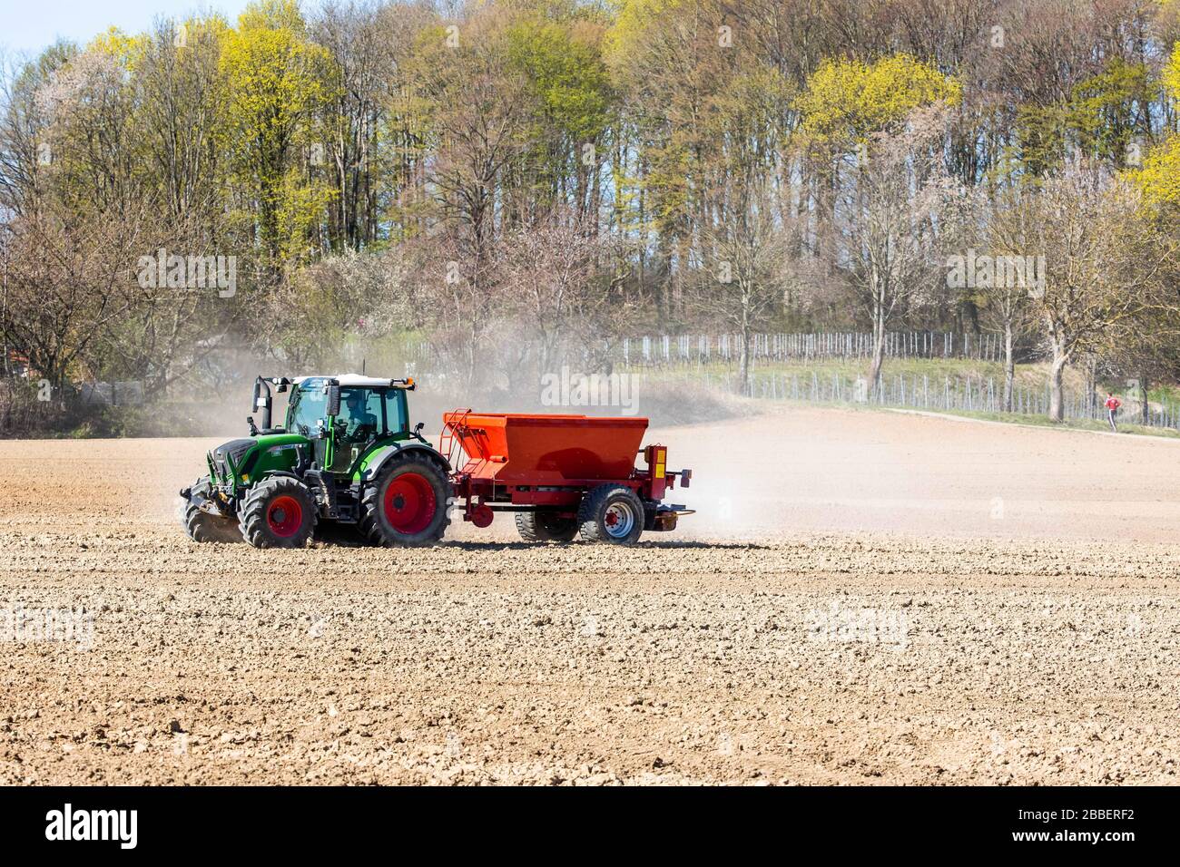 Bad Krozingen, Germany. 31st Mar, 2020. A farmer uses a fertilizer ...