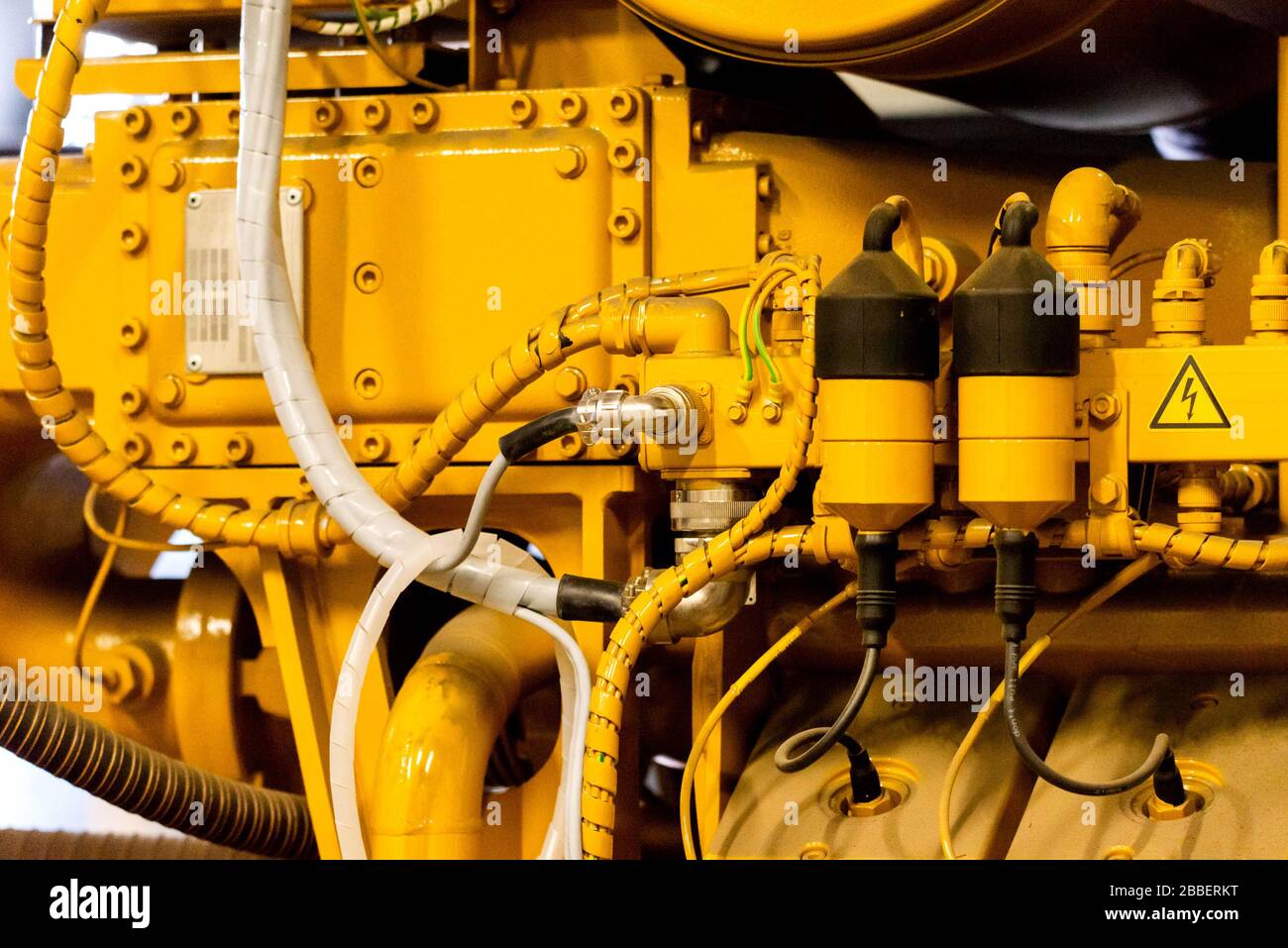 Fragment of yellow industrial diesel engine for electrical generator in ...