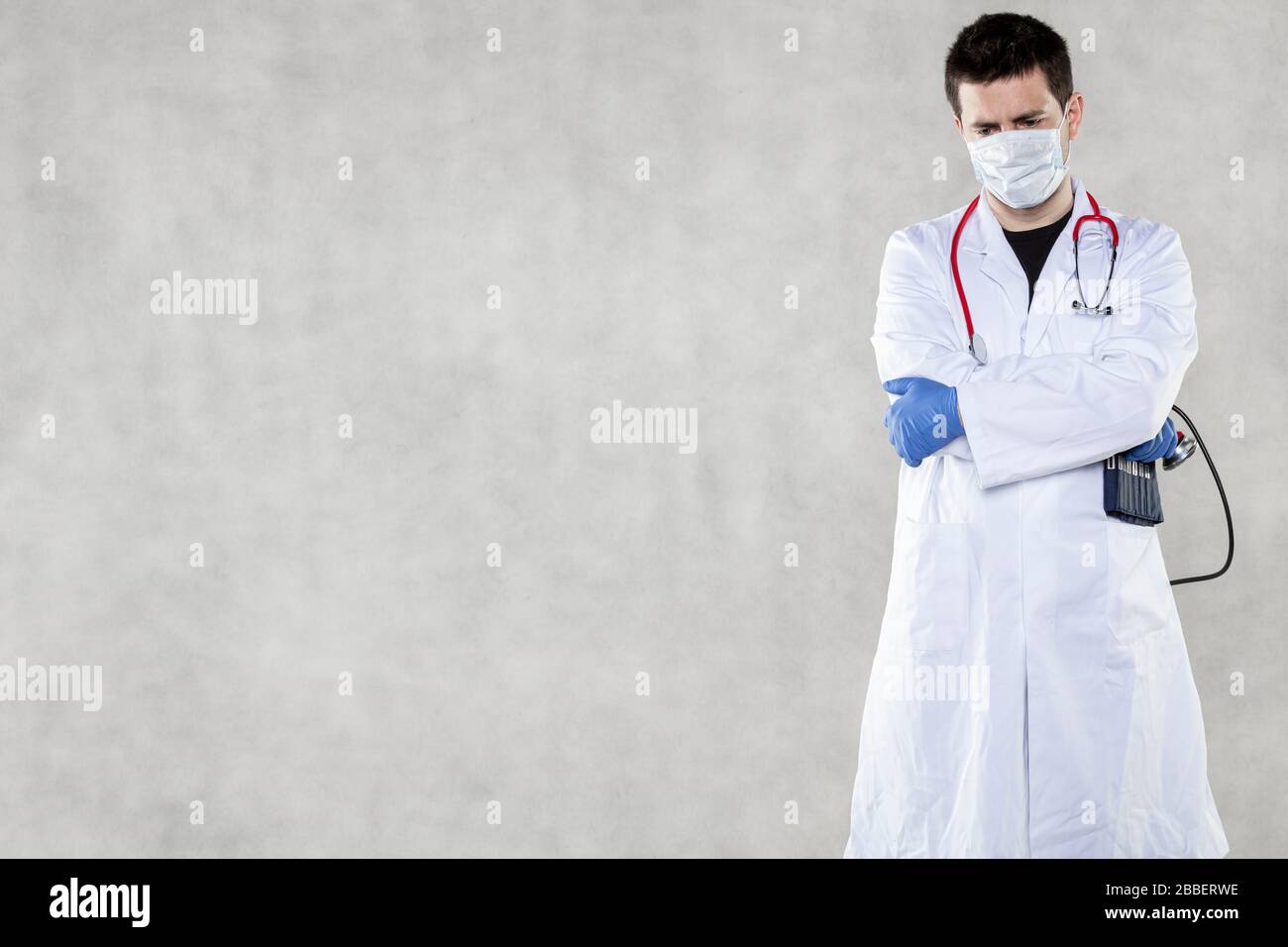 depressed doctor holding a blood pressure monitor Stock Photo - Alamy