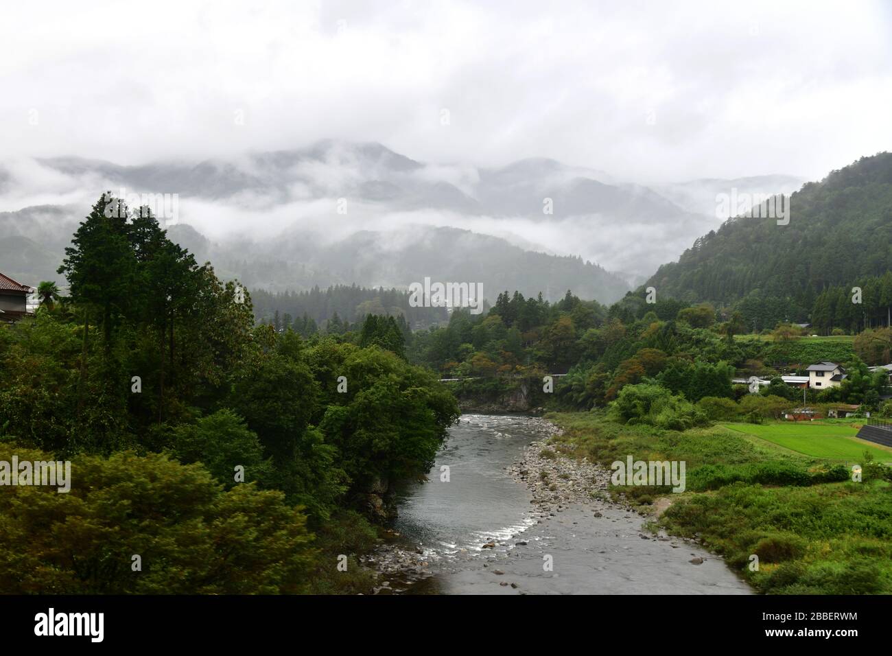 Lush green landscape along the Takayama Line and Hida River on the way ...