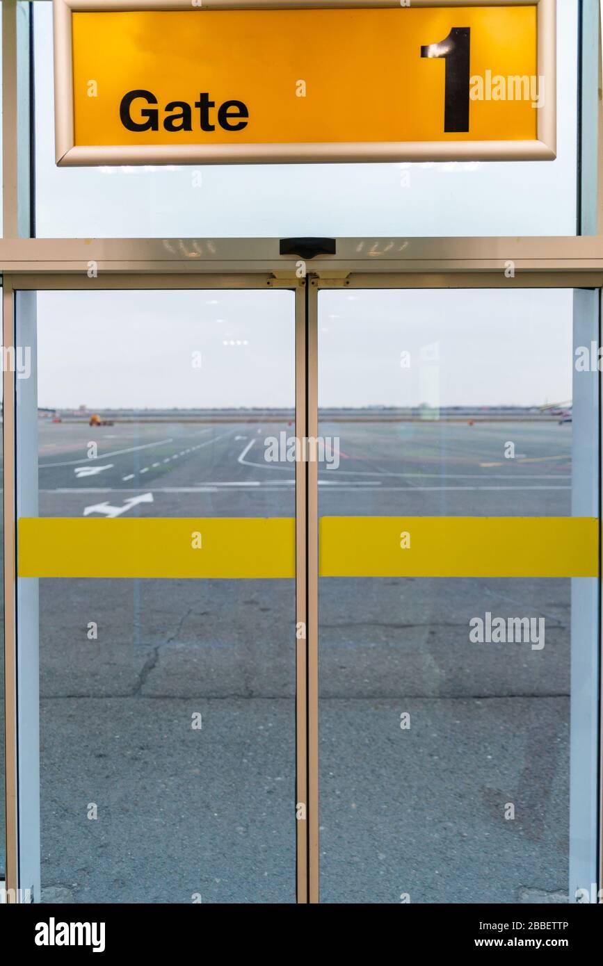 Airport gate door. Exit on outside to a plane Stock Photo - Alamy