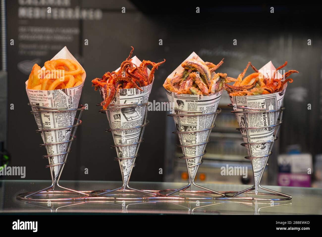 Madrid, Spain: Close up view of four paper cones filled with various ...