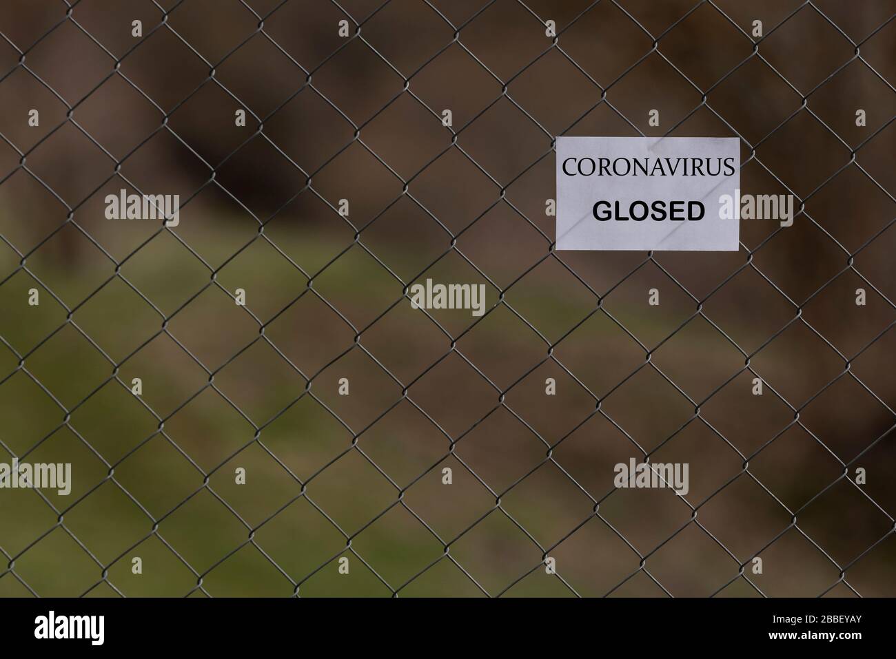 No entry due to coronavirus. Fence with coronavirus inscription and ...