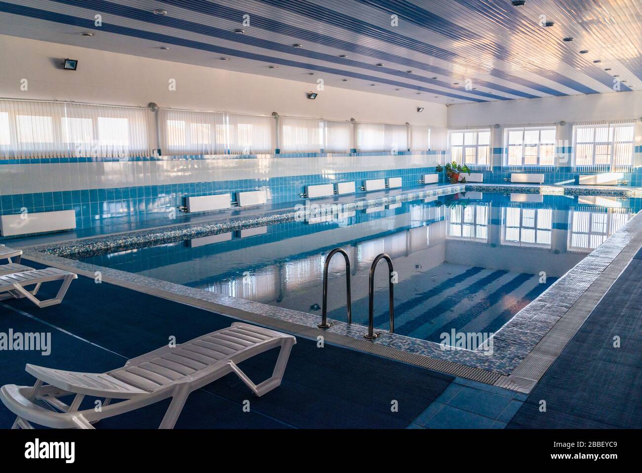 Modern interior of public swimming pool in hotel Stock Photo - Alamy