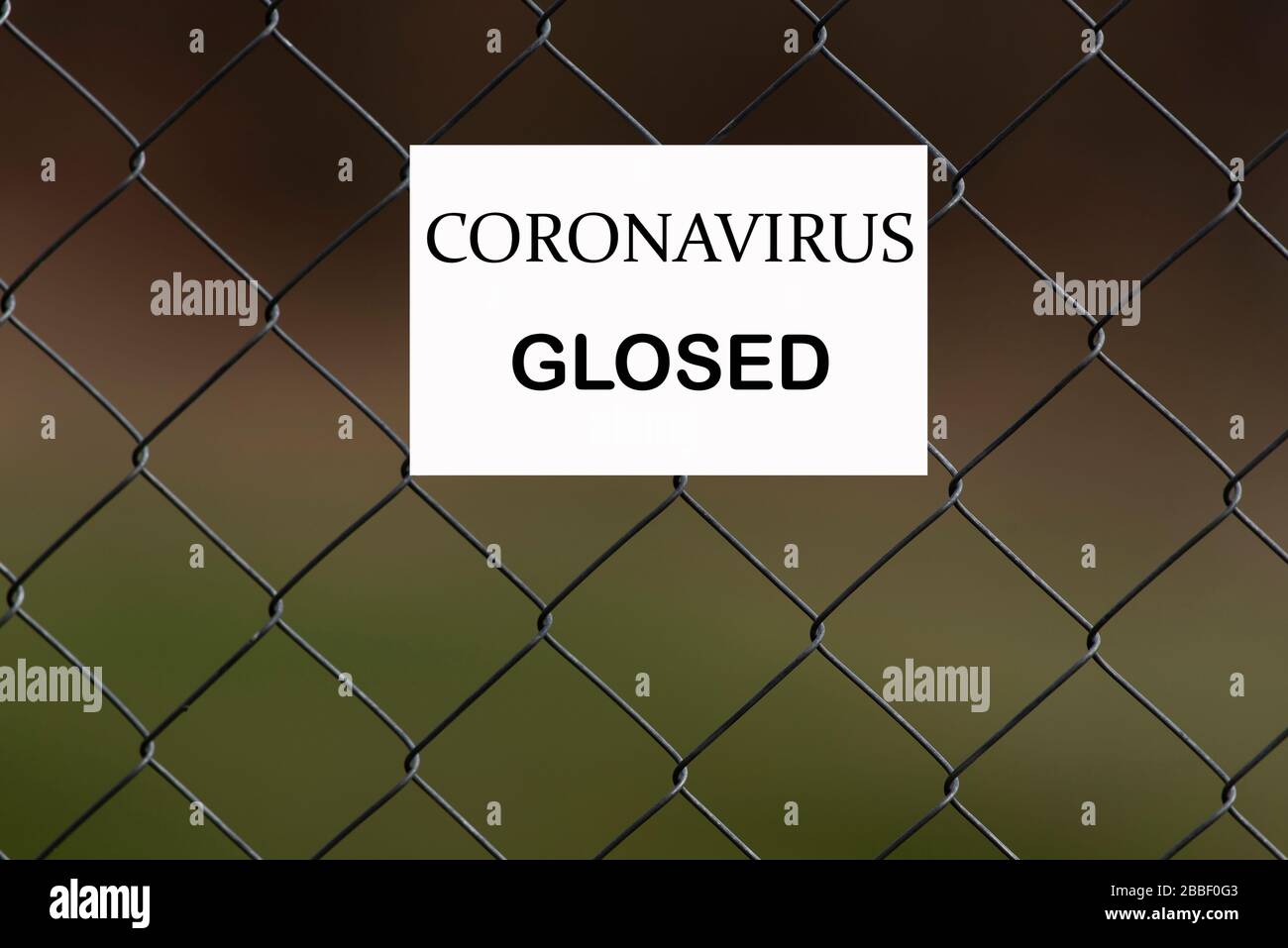 No entry due to coronavirus. Fence with coronavirus inscription and ...
