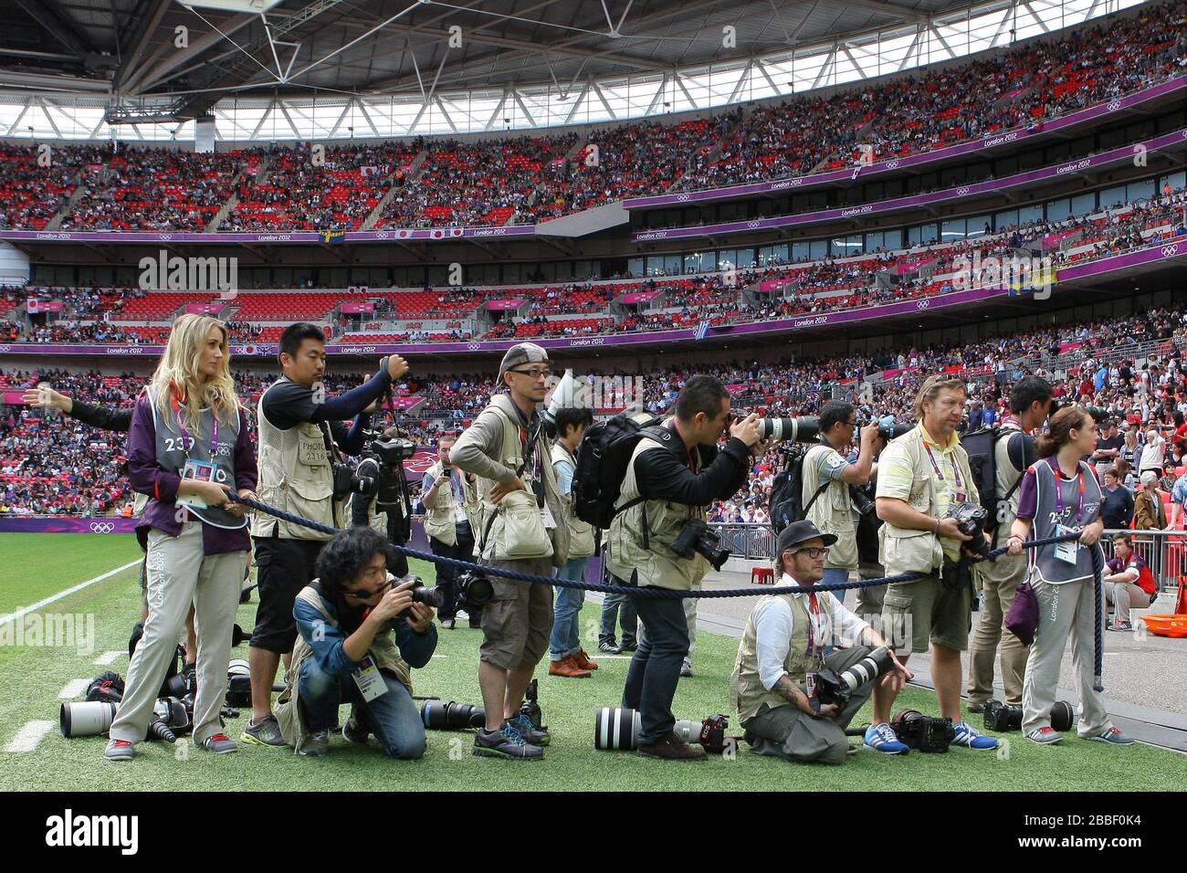 Photographers await the arrival of the teams Stock Photo - Alamy