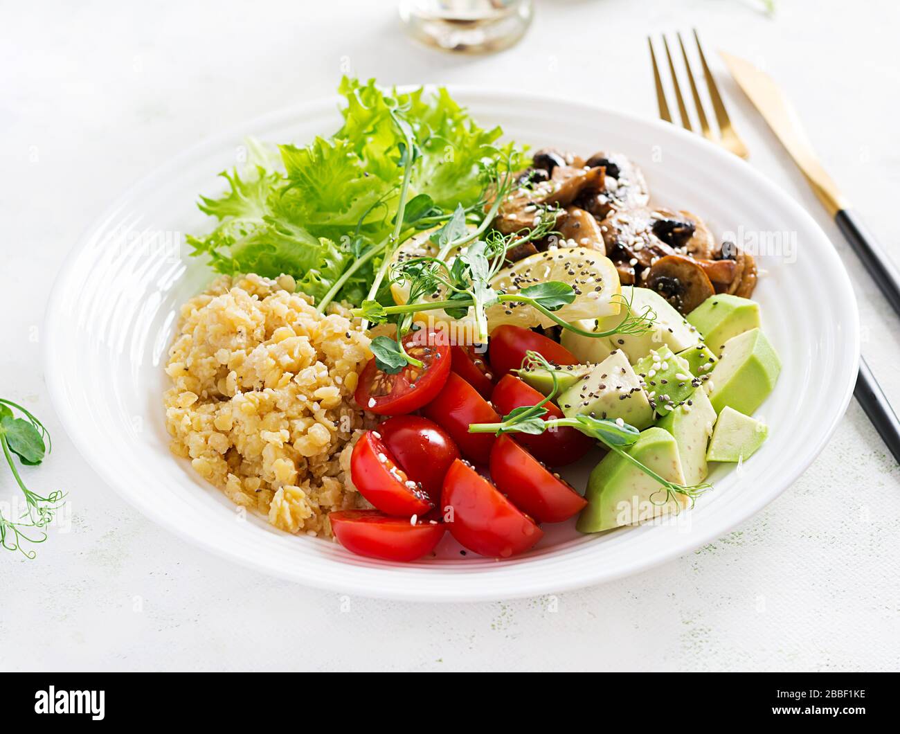 Trendy salad. Vegan Buddha bowl with lentil, avocado, mushrooms ...
