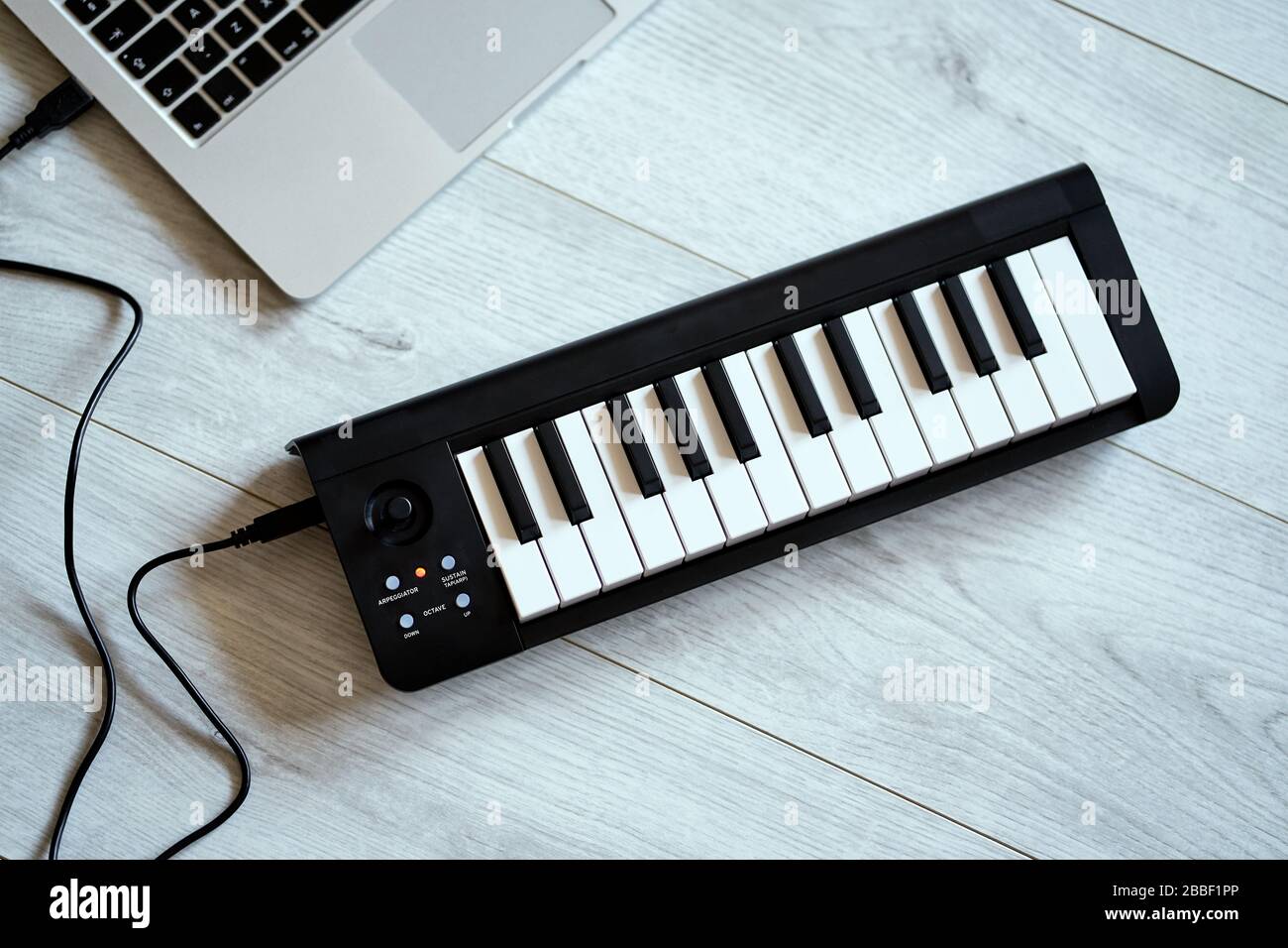keyboard musical instrument on a white floor Stock Photo - Alamy