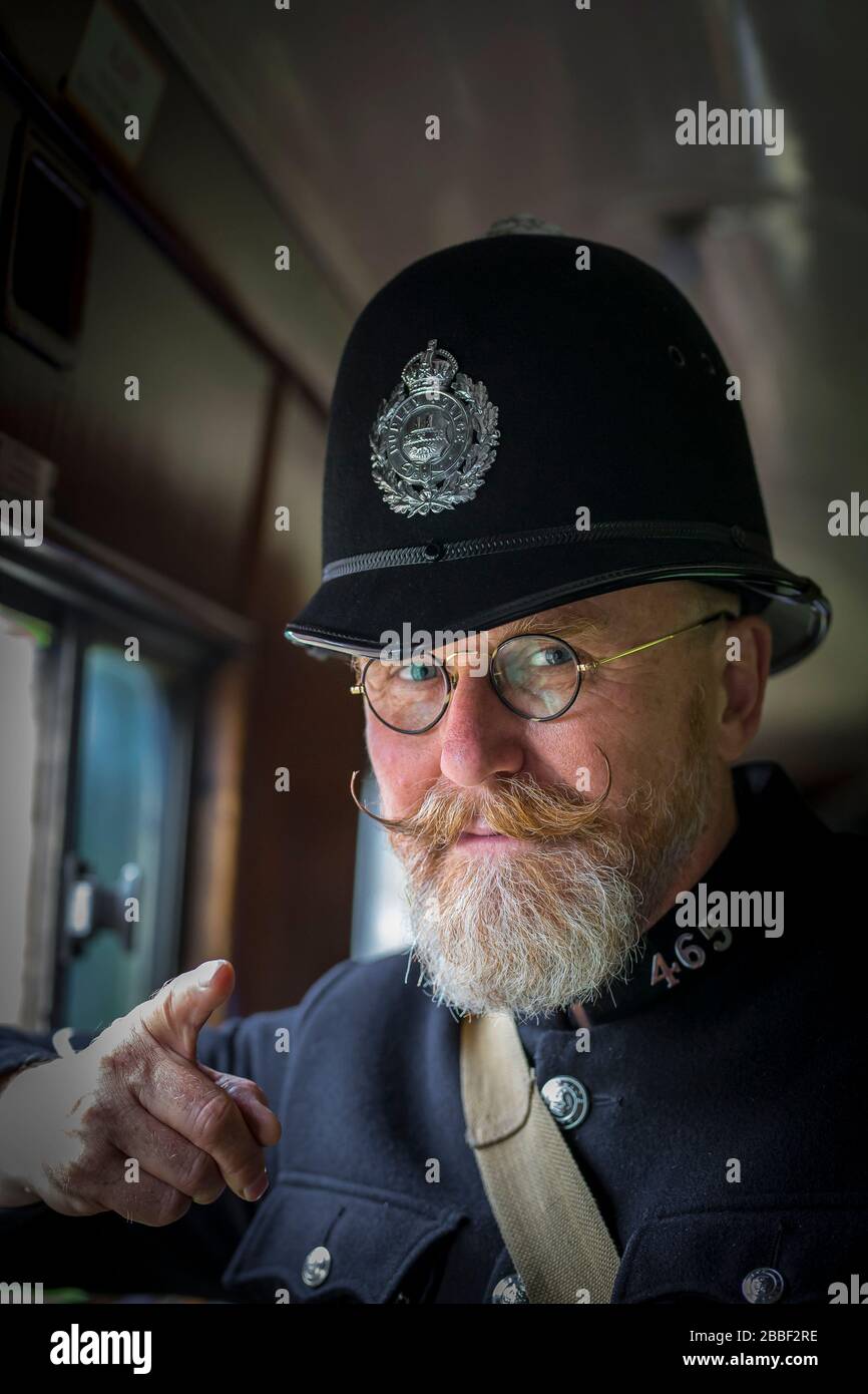 Isolated 1940s man with handlebar moustache as vintage UK policeman ...