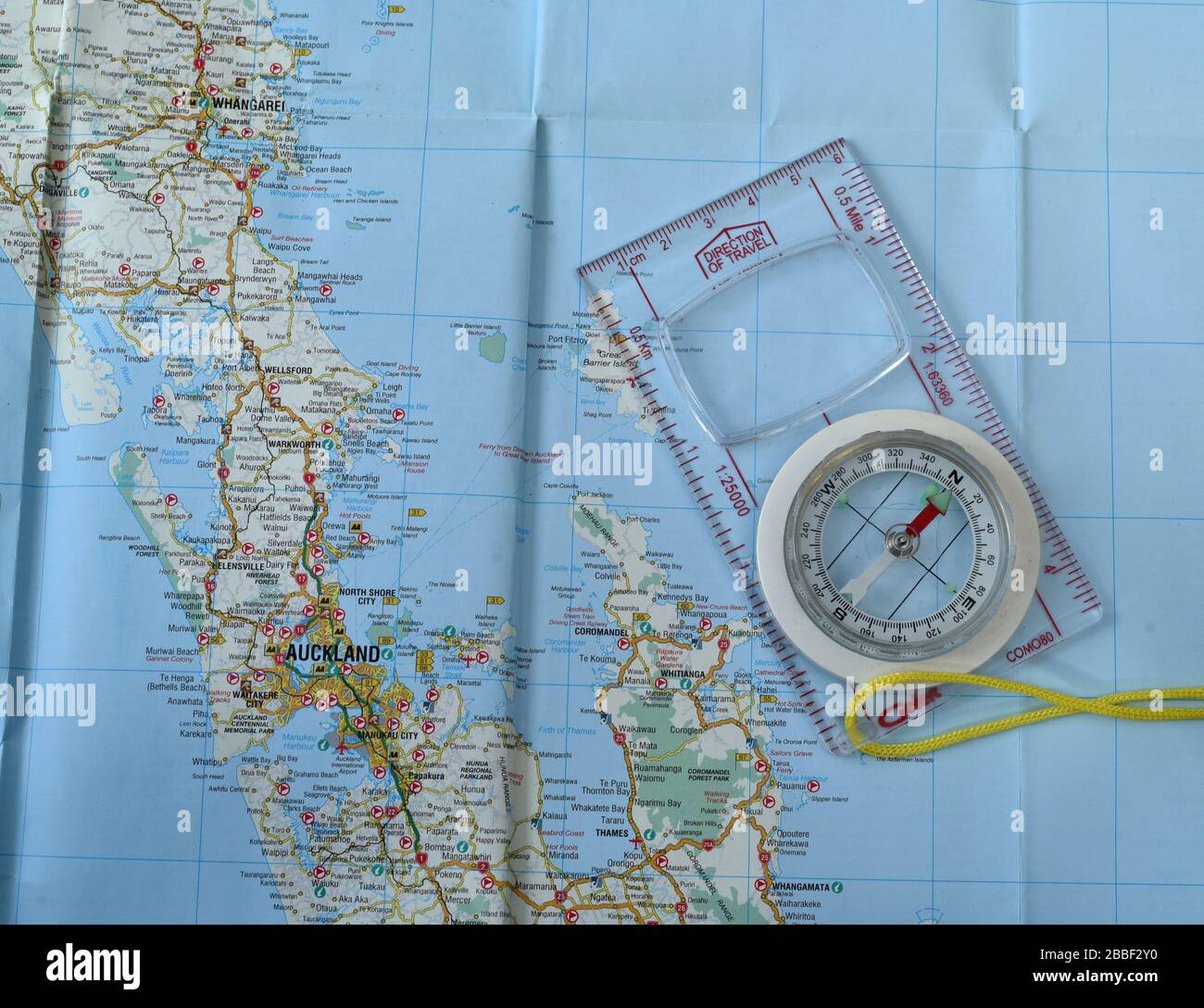 Map reading on a new zealand map with compass Stock Photo - Alamy