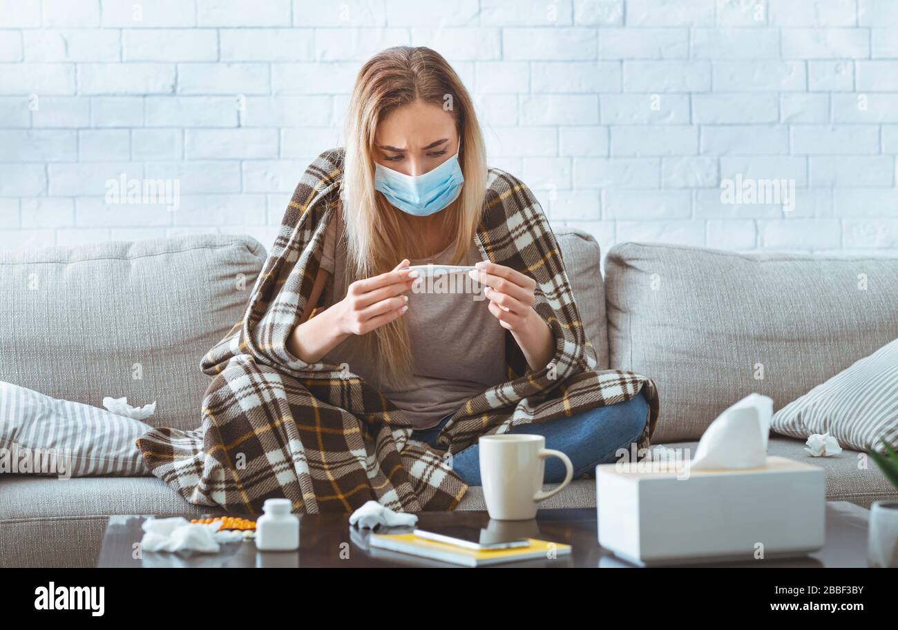 Temperature risen concept. Girl treated at home Stock Photo - Alamy