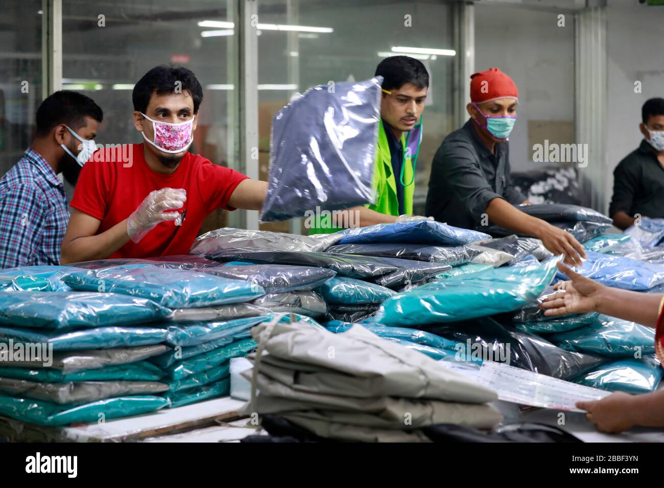 Dhaka, Bangladesh - March 31, 2020: Workers producing personal ...