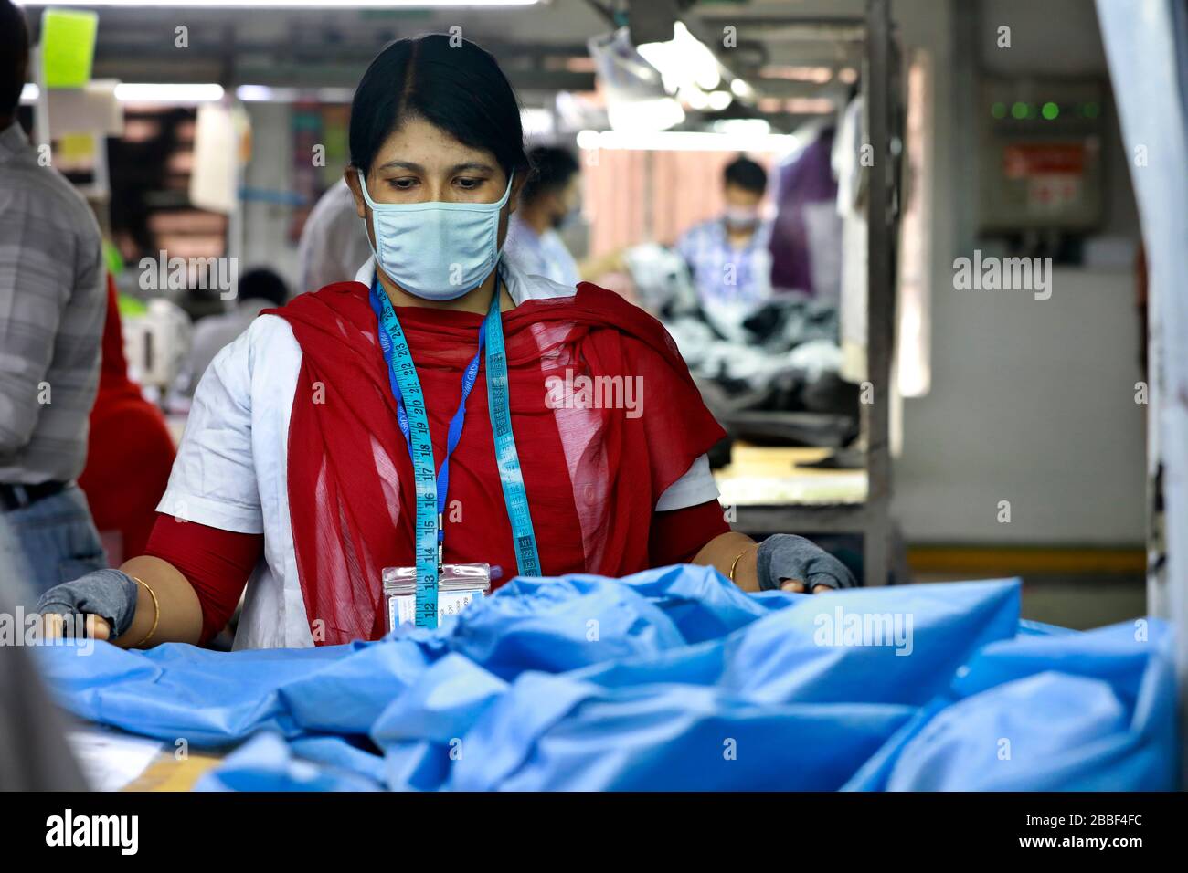Dhaka, Bangladesh - March 31, 2020: Workers producing personal ...