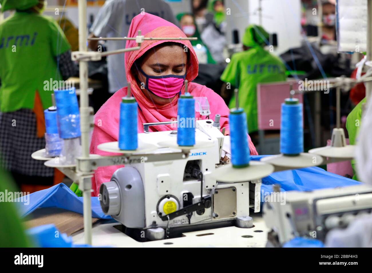 Dhaka, Bangladesh - March 31, 2020: Workers producing personal ...