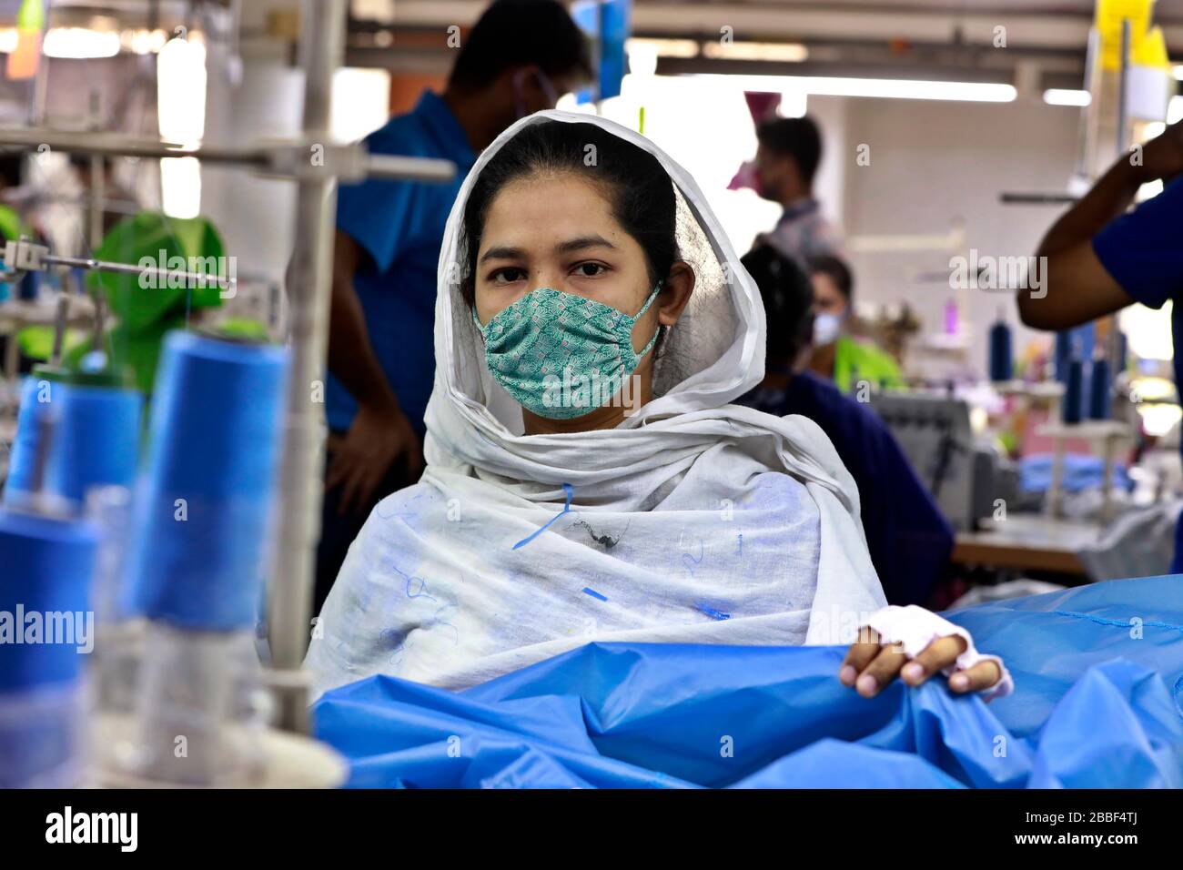 Dhaka, Bangladesh - March 31, 2020: Workers producing personal ...