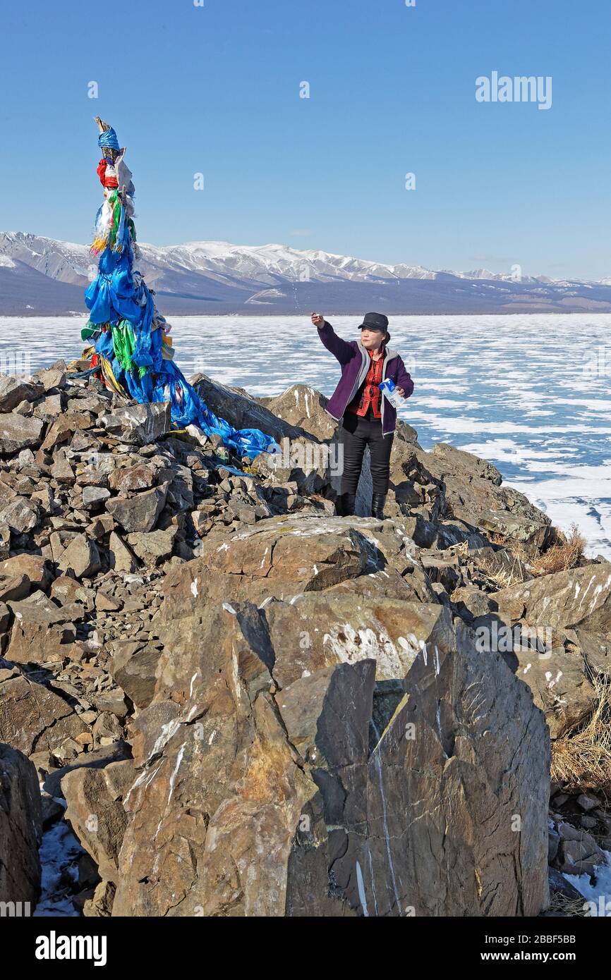 KHATGAL, MONGOLIA, March 5, 2020 : Travelers use to circle an ovoo ...