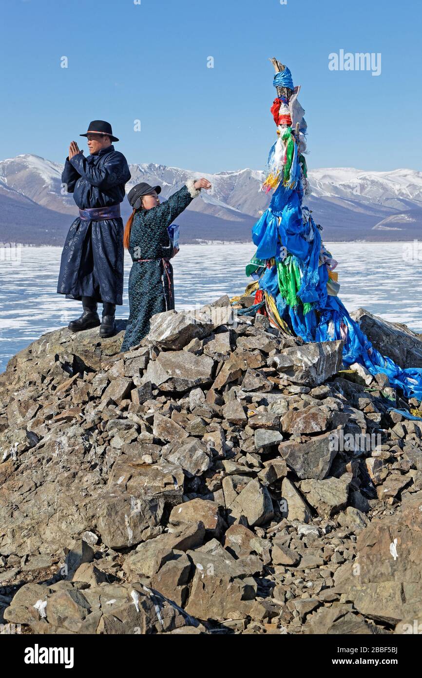 KHATGAL, MONGOLIA, March 5, 2020 : Travelers use to circle an ovoo ...